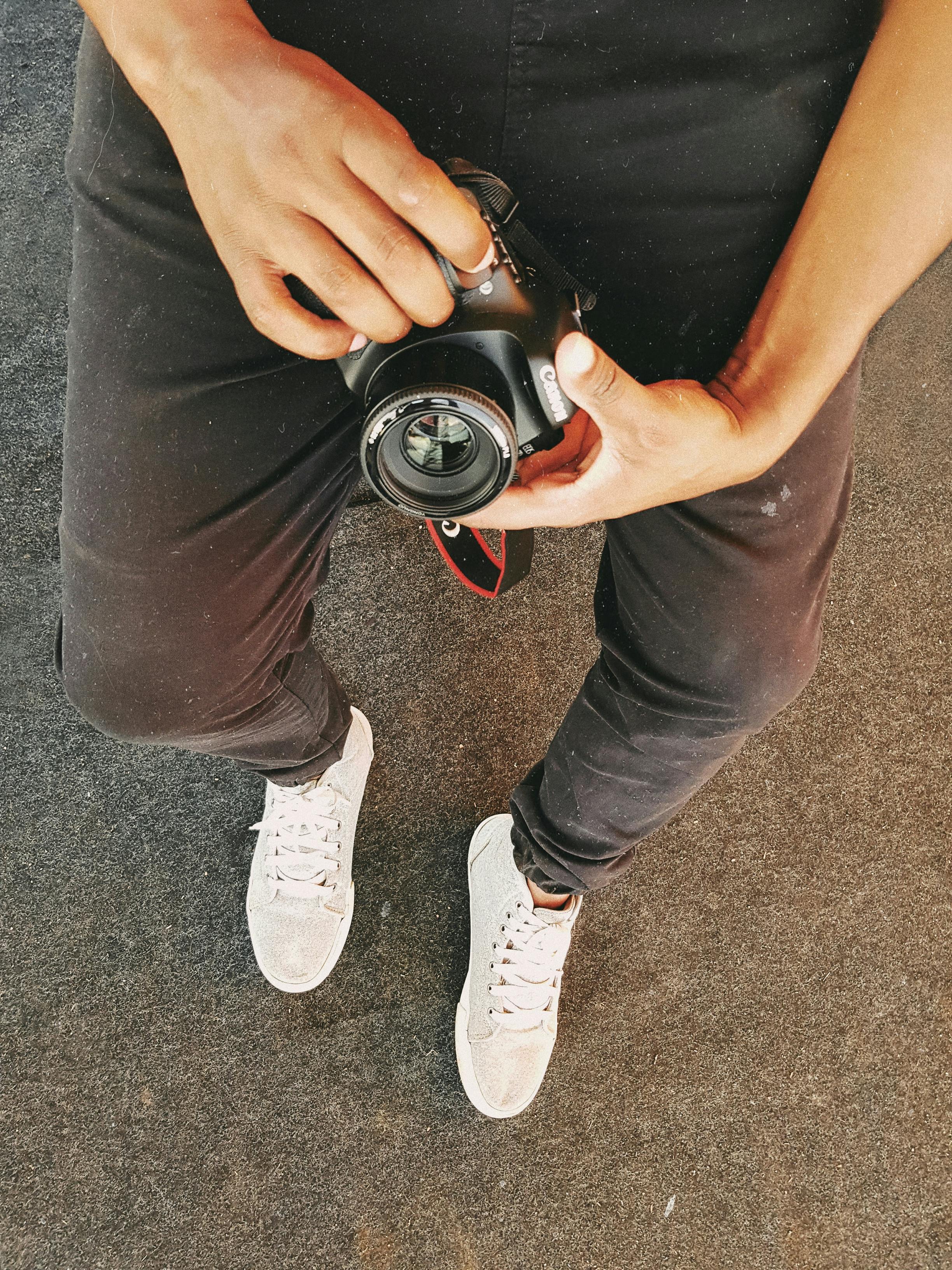 Person Holding Black Dslr Camera · Free Stock Photo