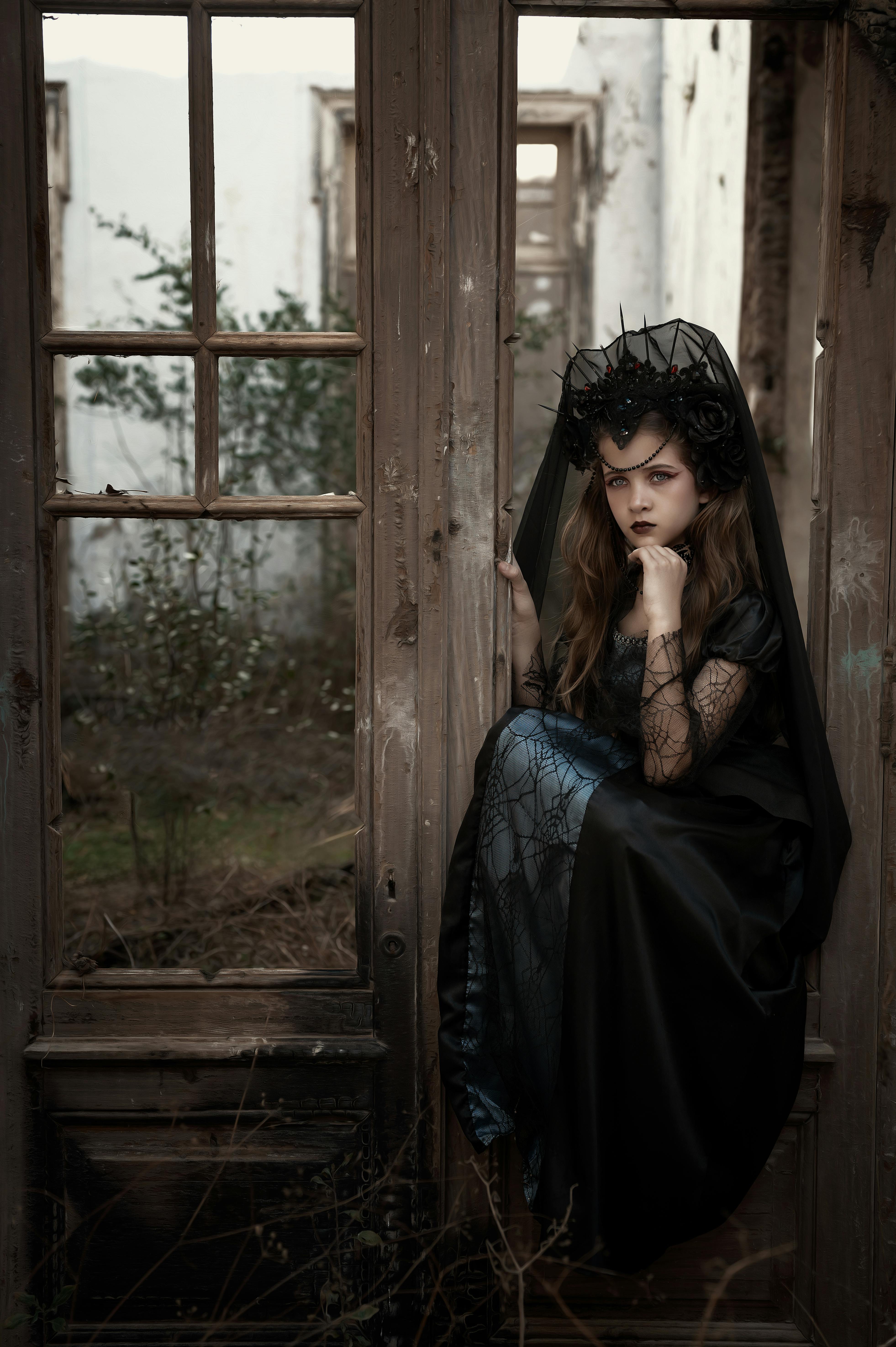 Mysterious Young Woman in Gothic Attire in Ruins · Free Stock Photo