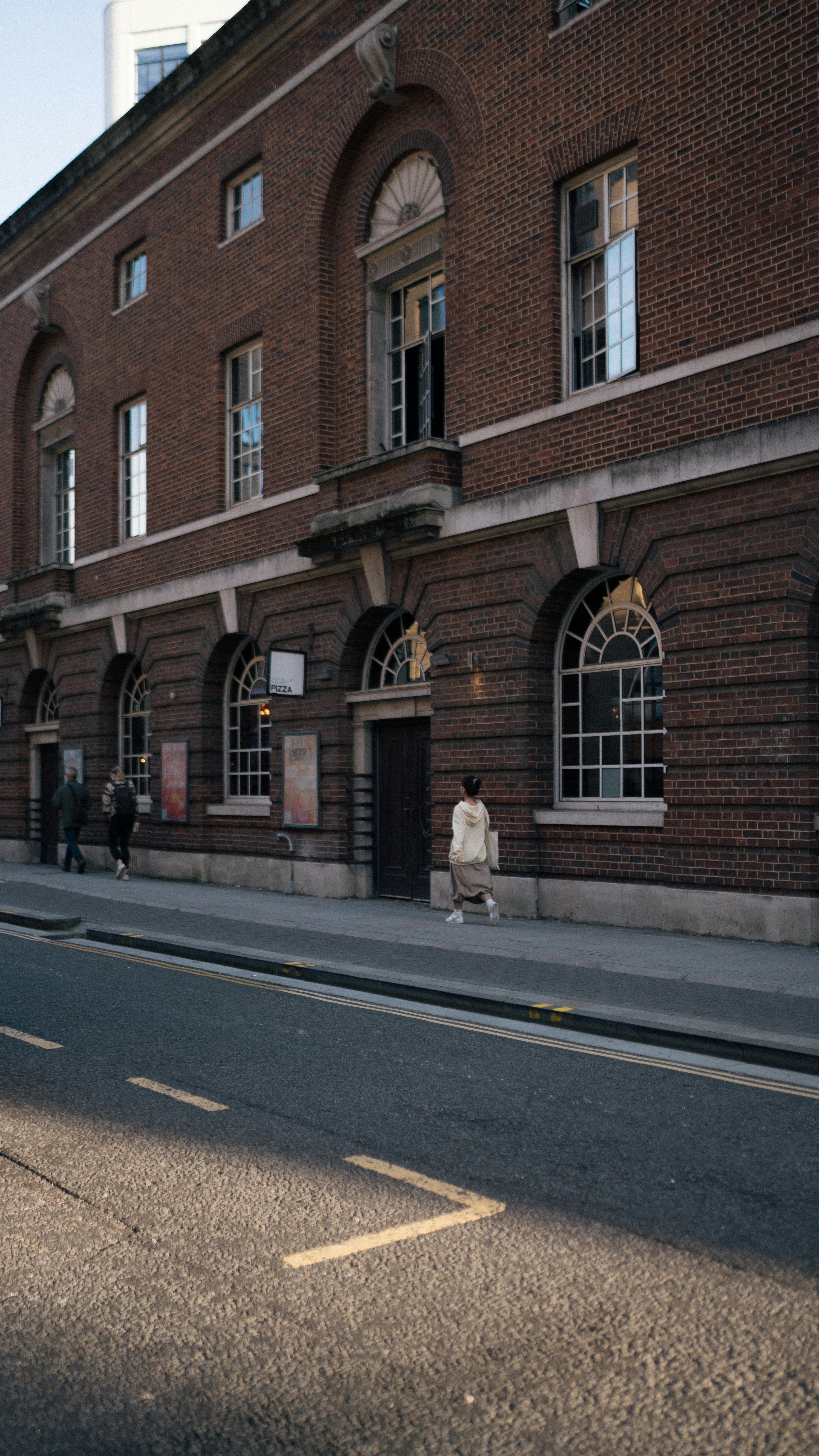 Historic Brick Building Street Scene in Daylight · Free Stock Photo