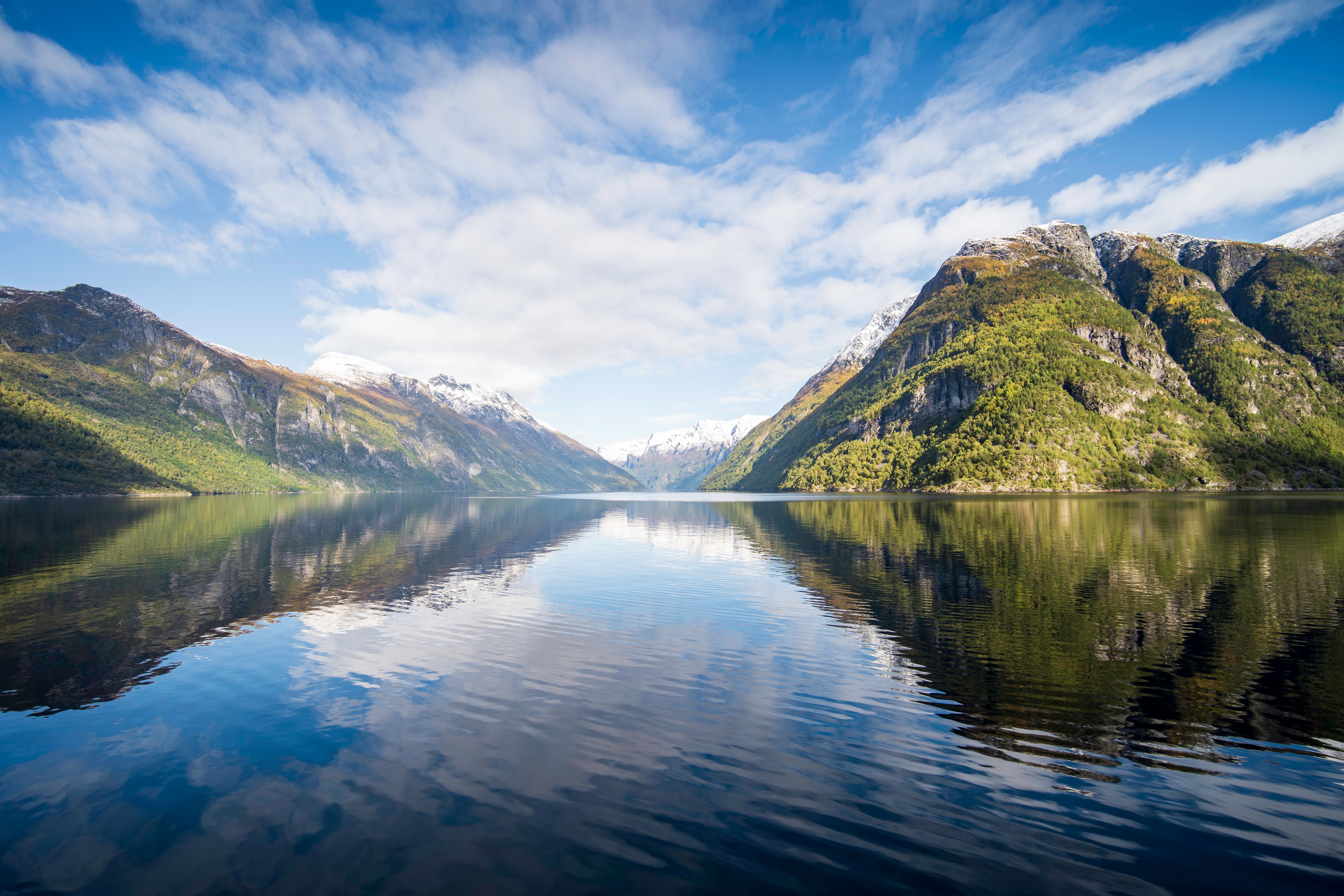 Breathtaking Norwegian Fjord Reflection Scene · Free Stock Photo