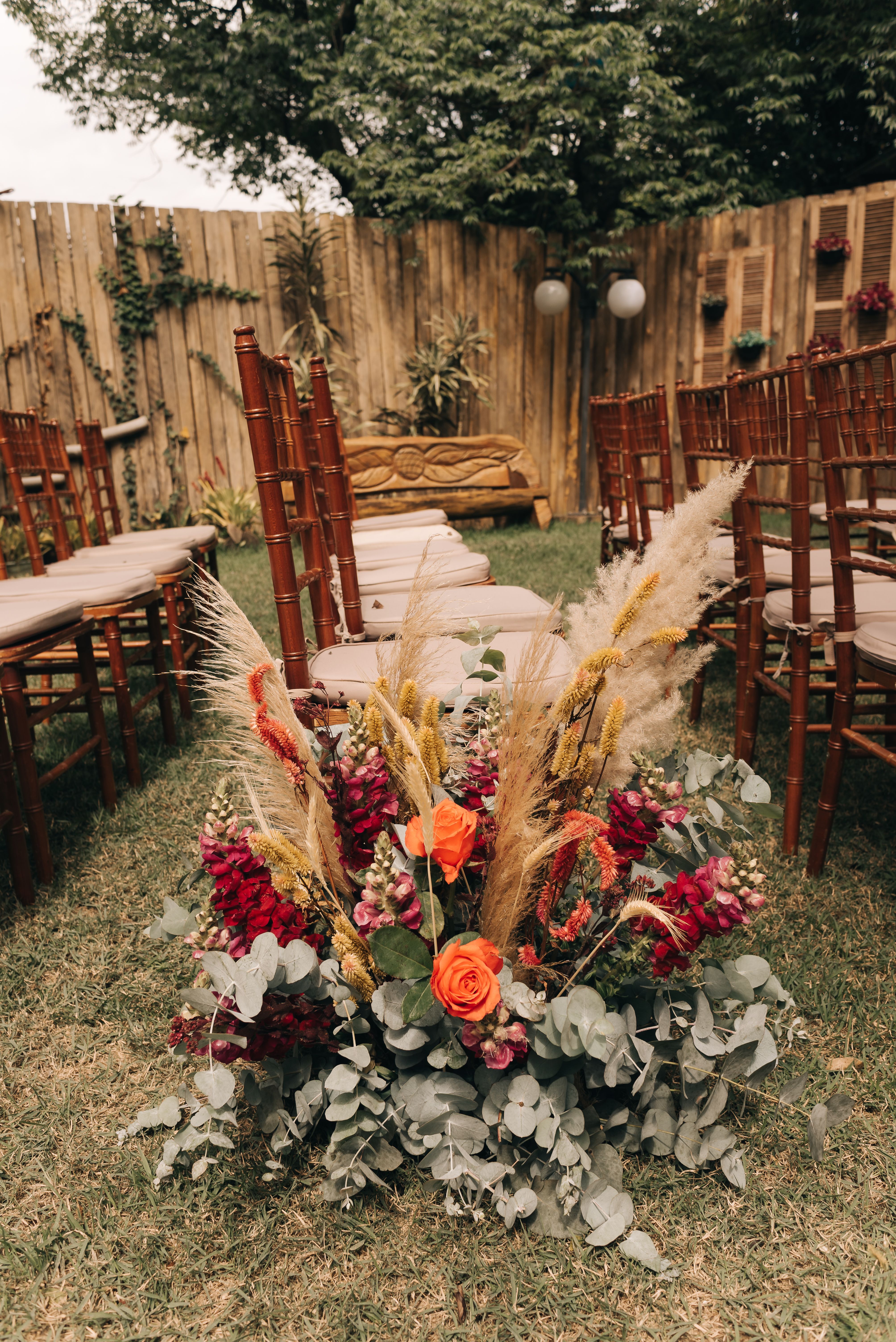 Rustic Outdoor Wedding Setup with Floral Arrangement · Free Stock Photo