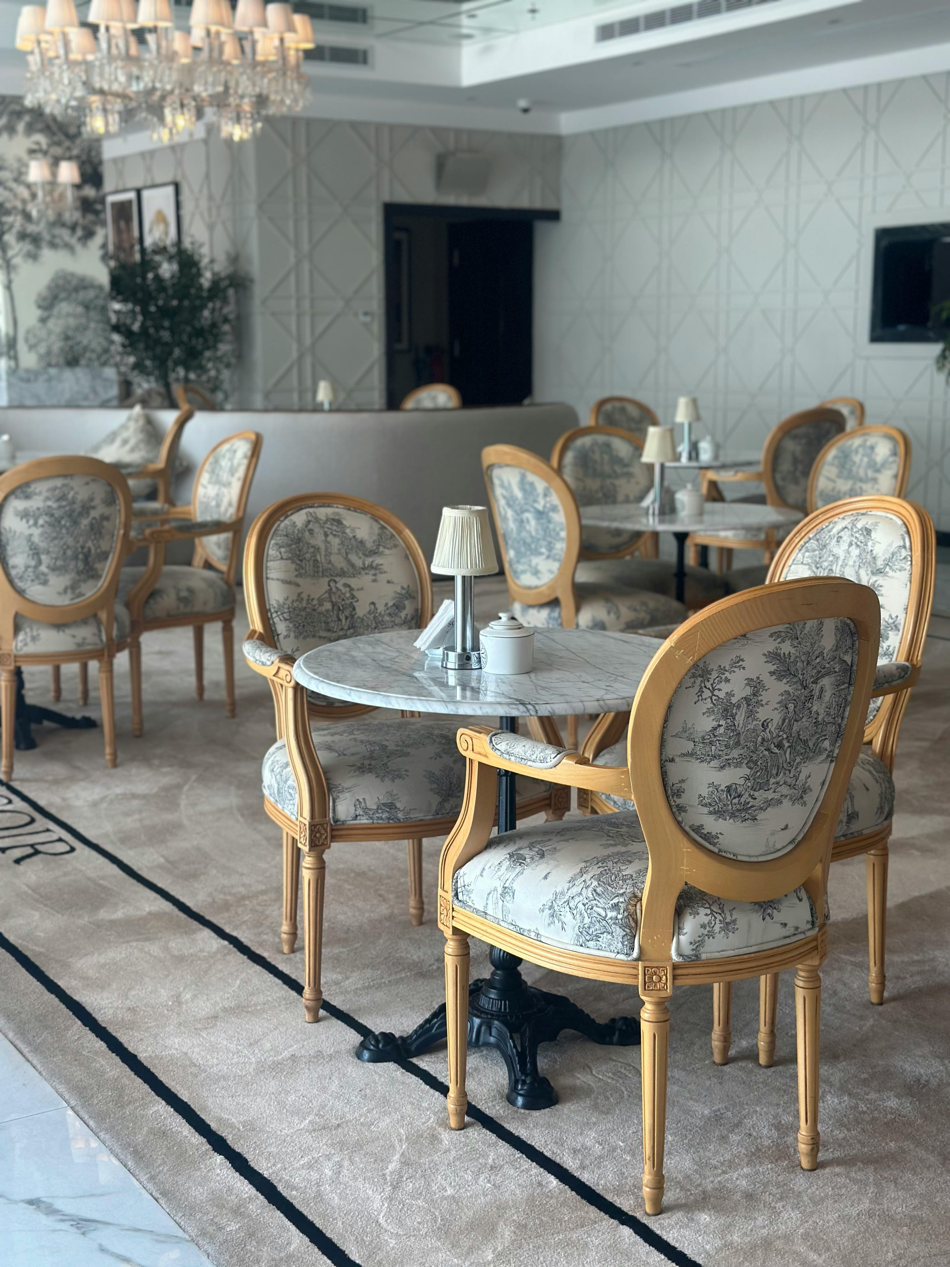 Elegant French-style Cafe Interior with Classic Charm · Free Stock Photo