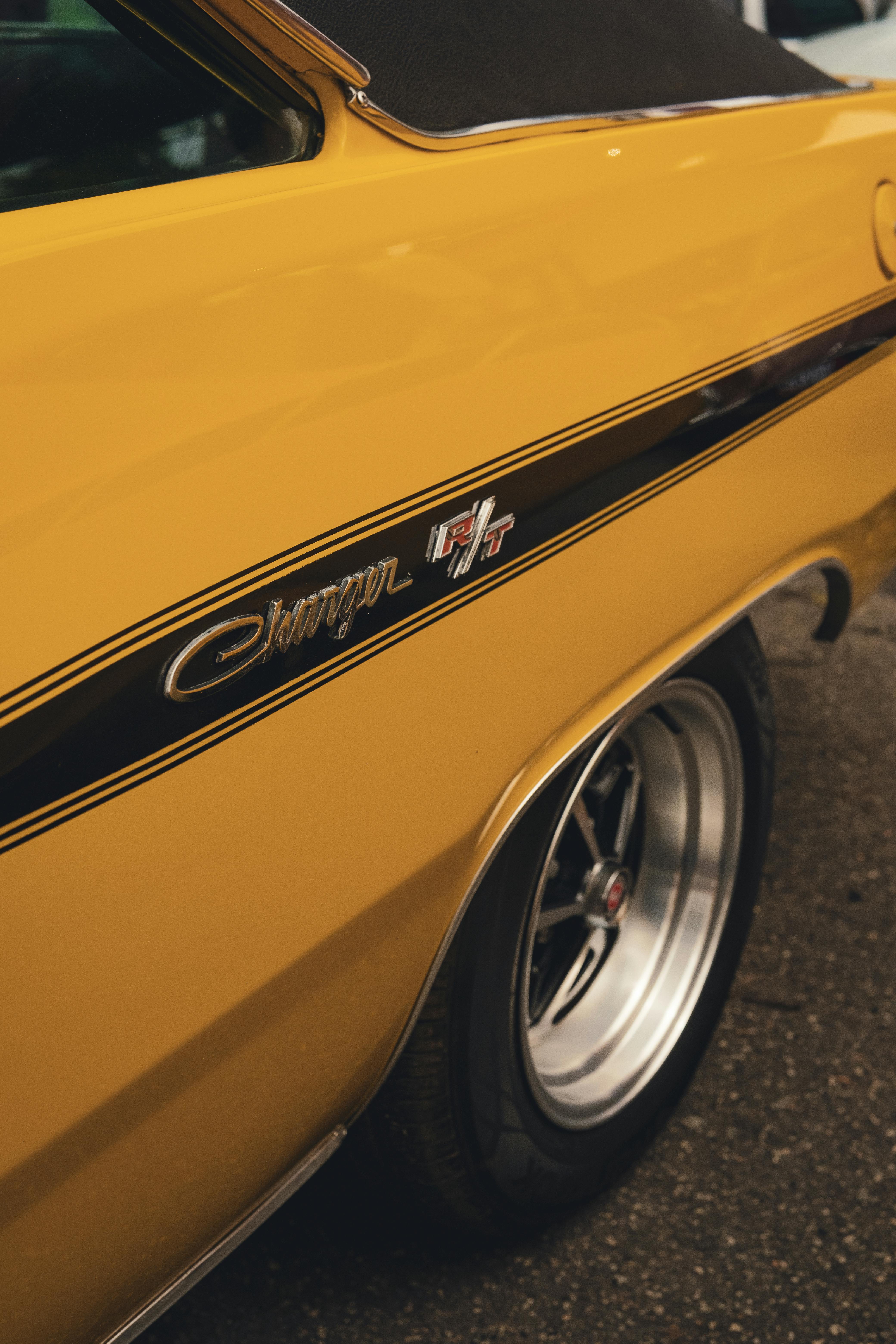 Classic Yellow Muscle Car with Black Stripe Detail · Free Stock Photo