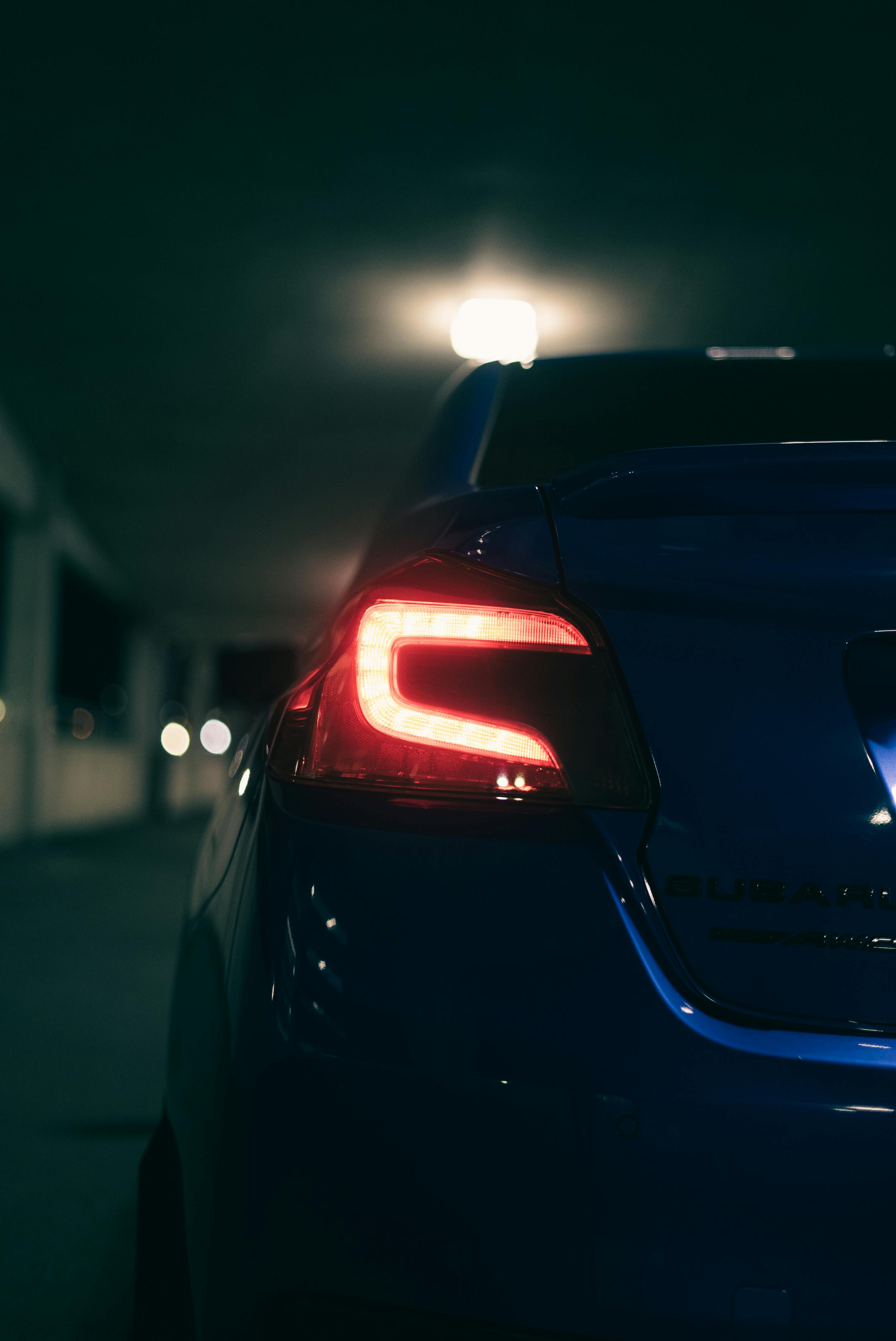 Rear View of a Modern Car at Night · Free Stock Photo