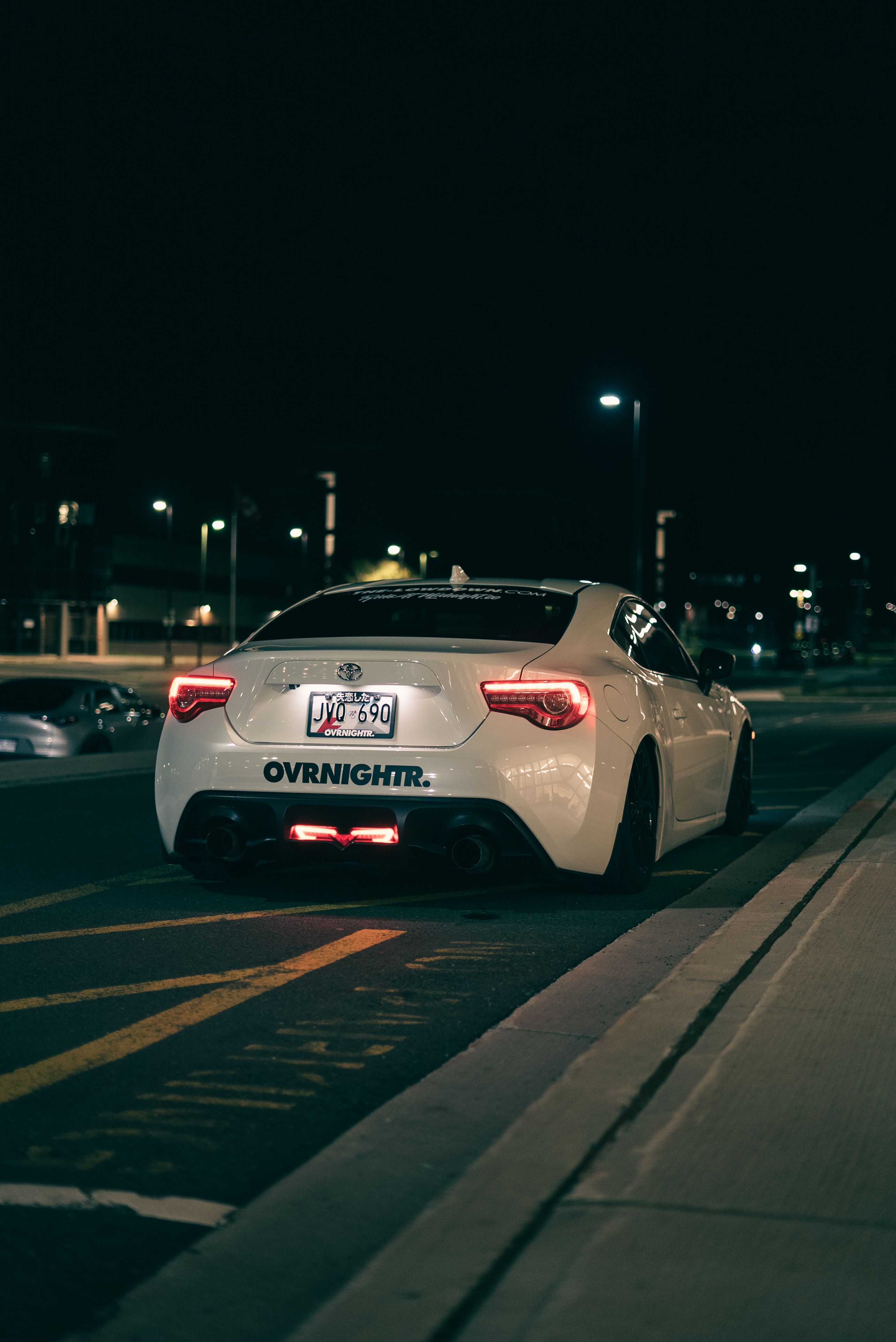 White Sports Car at Night on Urban Street · Free Stock Photo