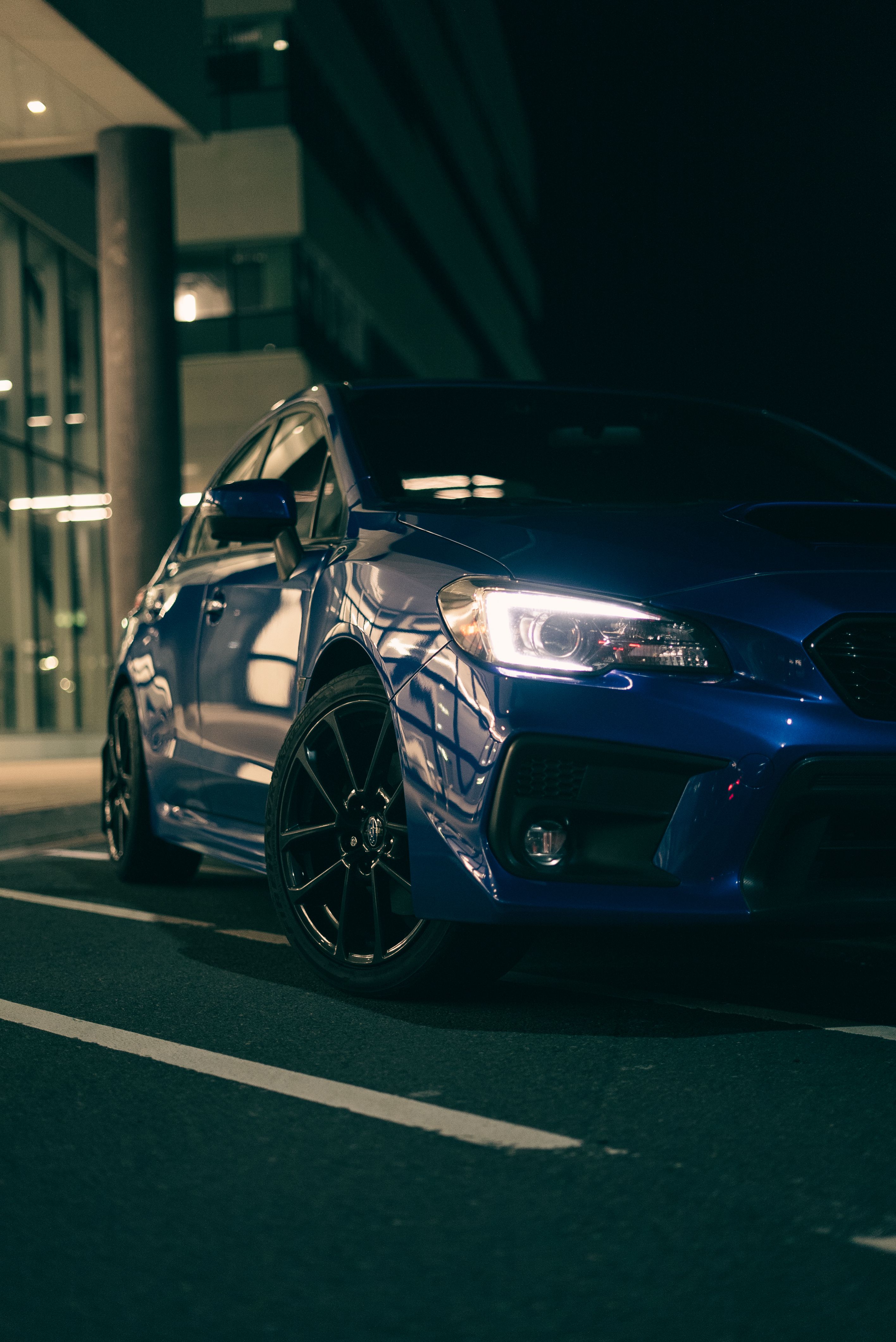 Blue Sports Car at Night in Urban Setting · Free Stock Photo