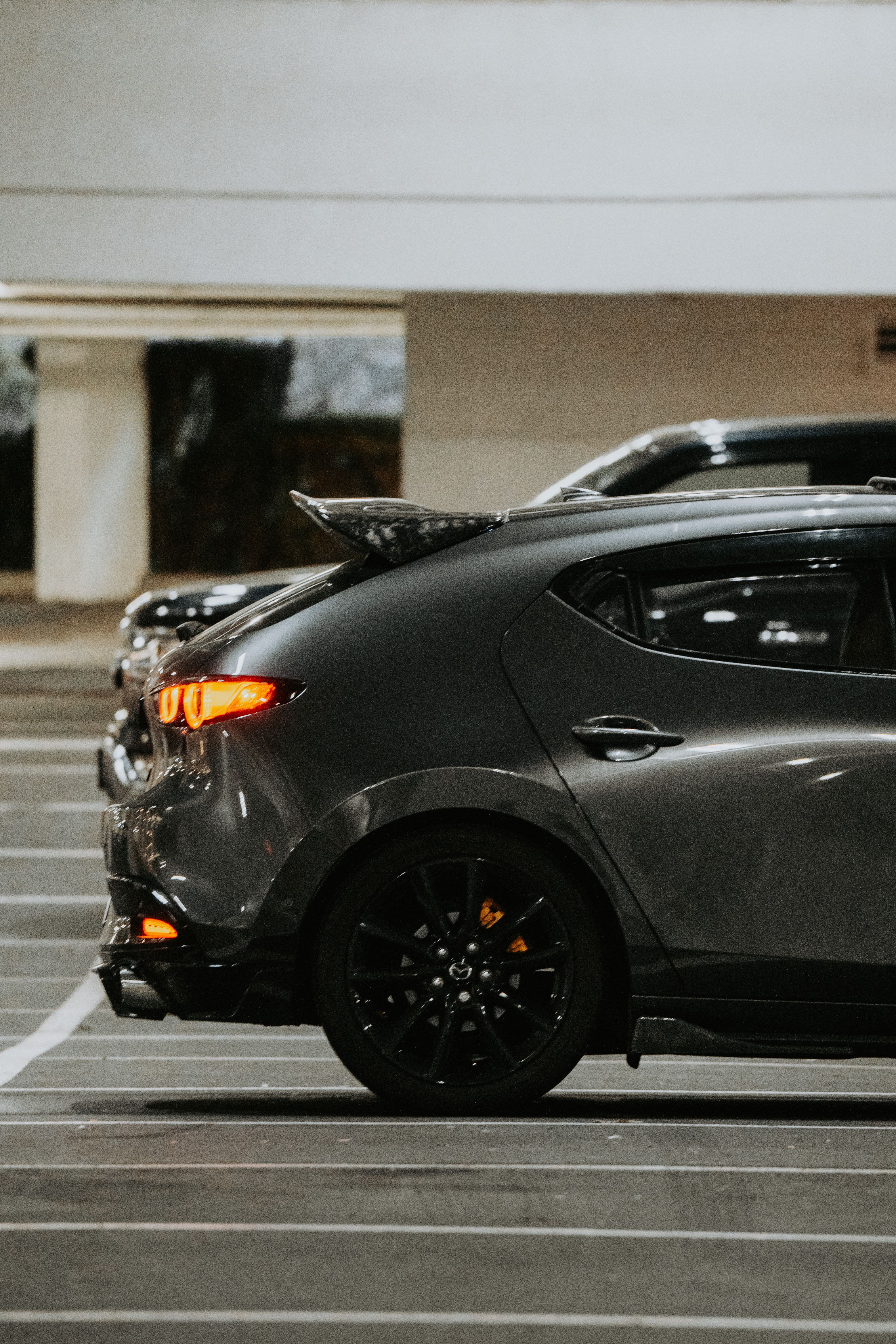 Sleek Grey Car in Urban Parking Garage · Free Stock Photo