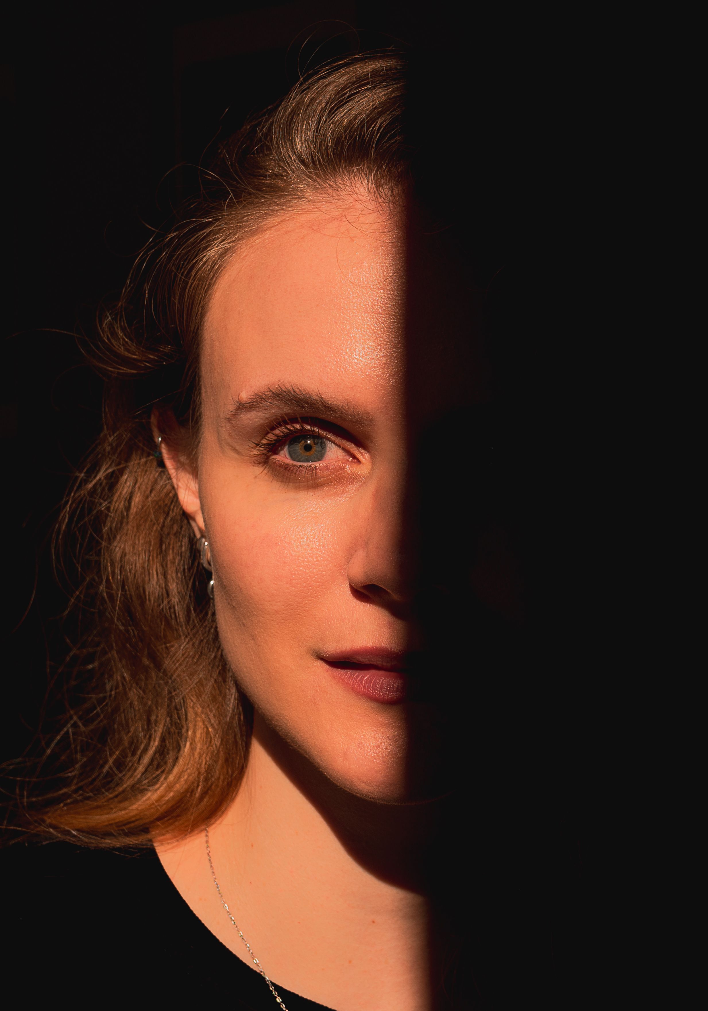 Artistic Portrait with Dramatic Shadow Play · Free Stock Photo