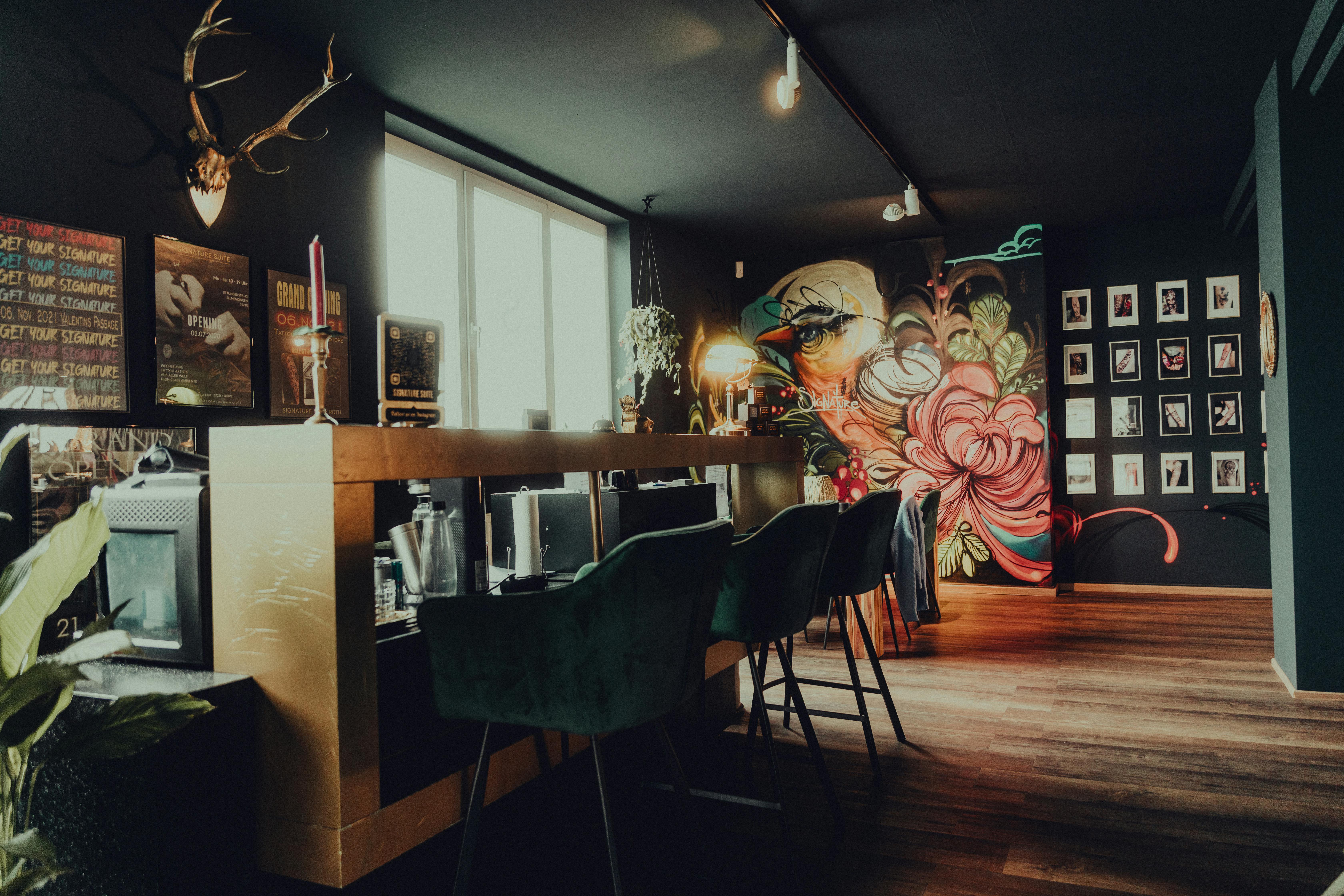 Colorful Tattoo Studio Interior with Artistic Murals · Free Stock Photo