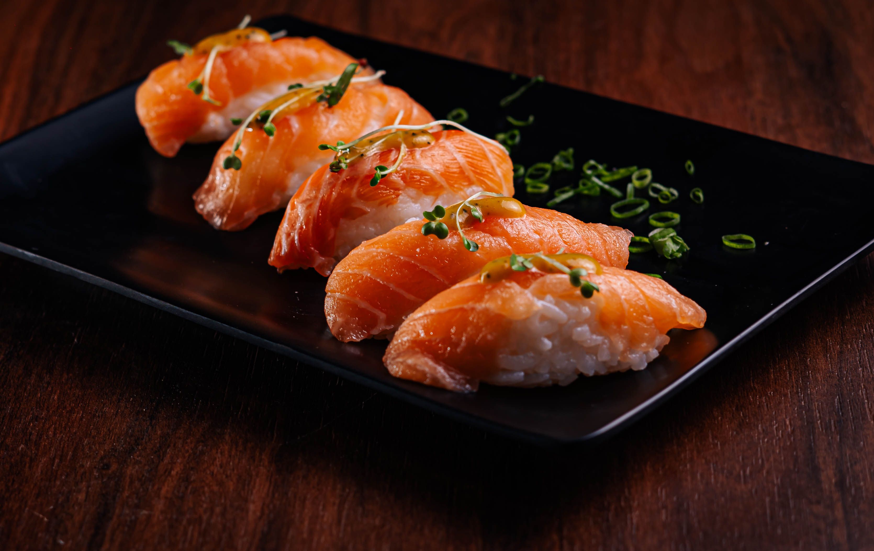 Fresh Salmon Nigiri Sushi on Black Plate · Free Stock Photo
