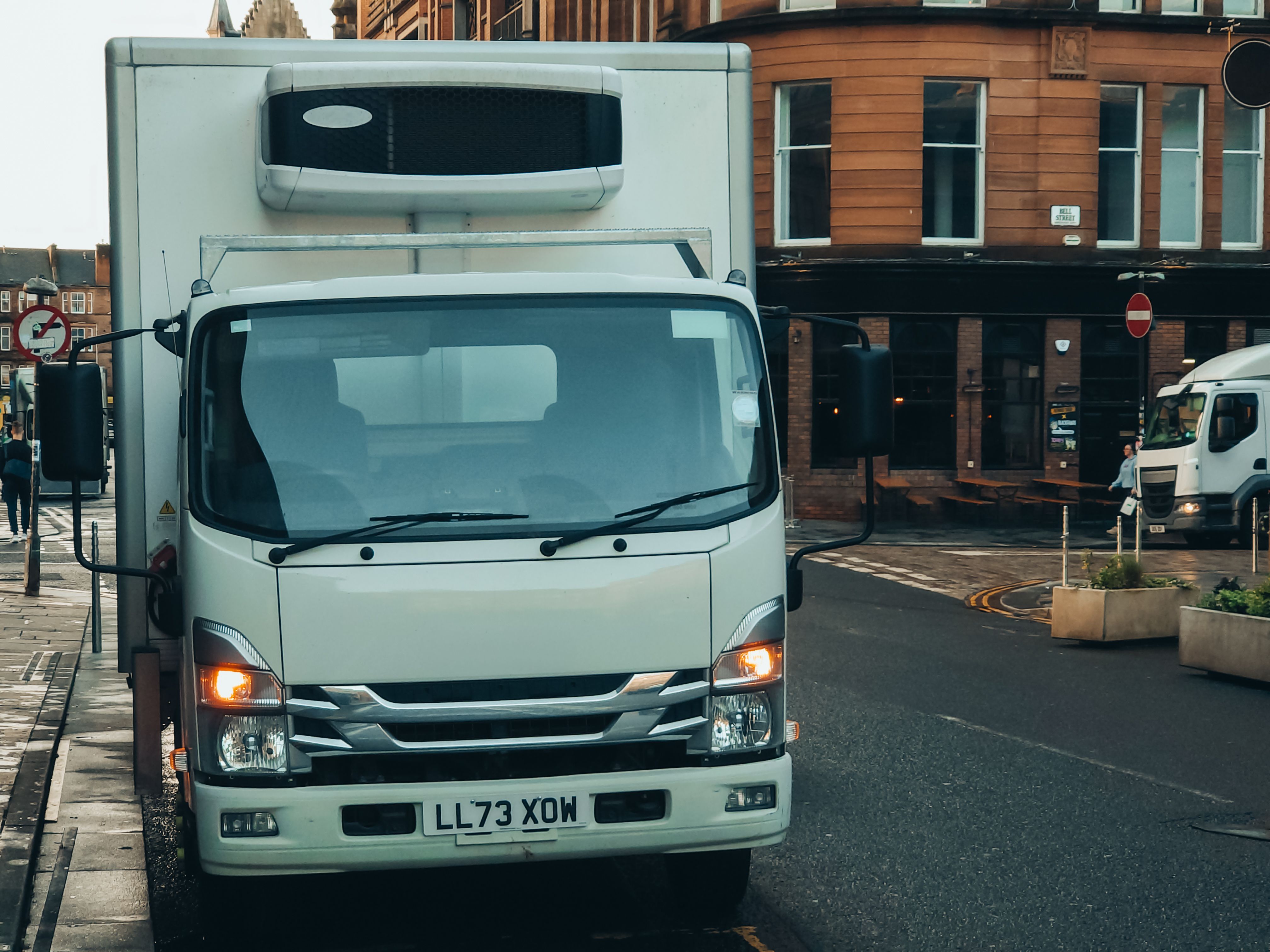 Urban Delivery Truck on City Street · Free Stock Photo