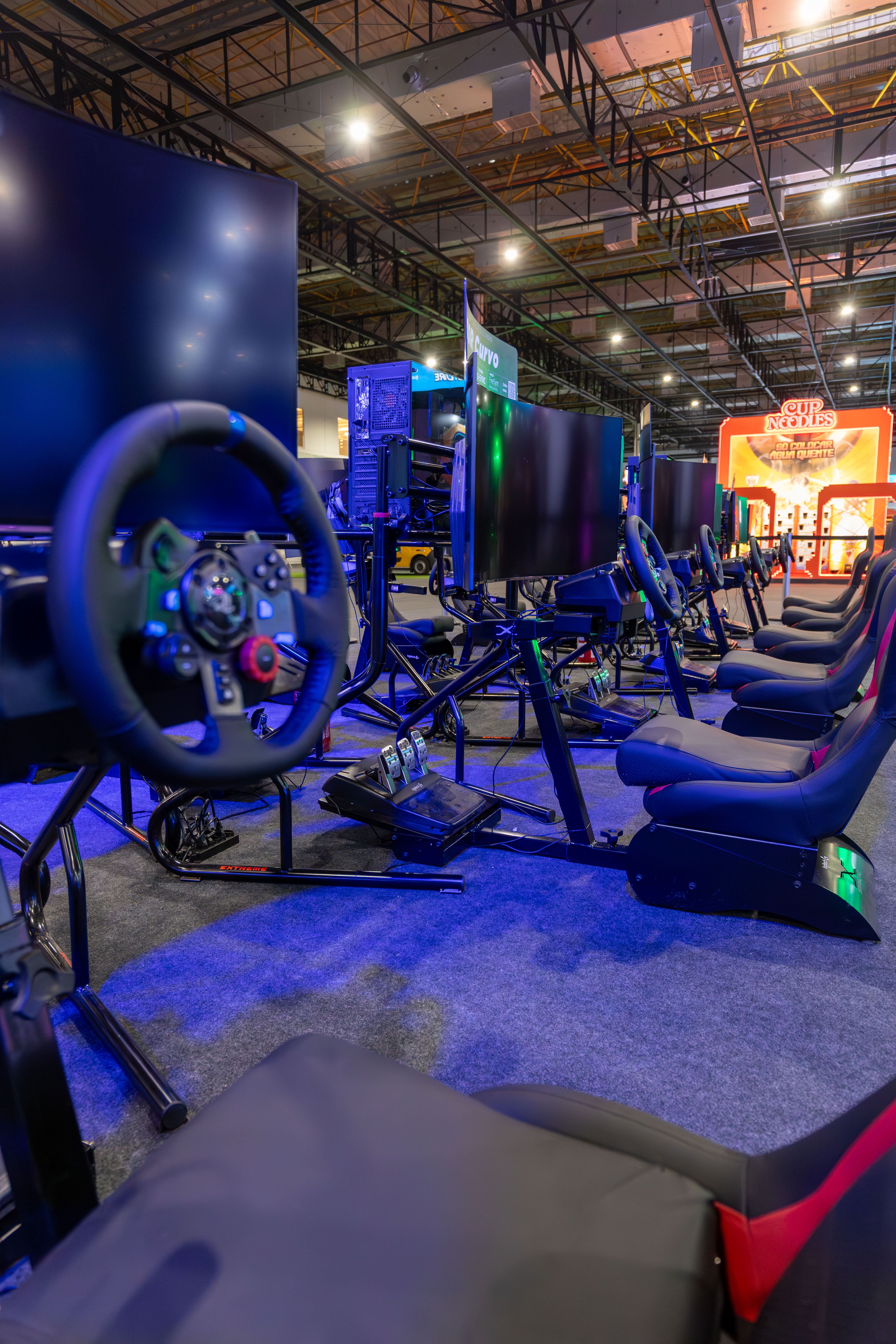 Indoor Gaming Arena with Racing Simulators · Free Stock Photo