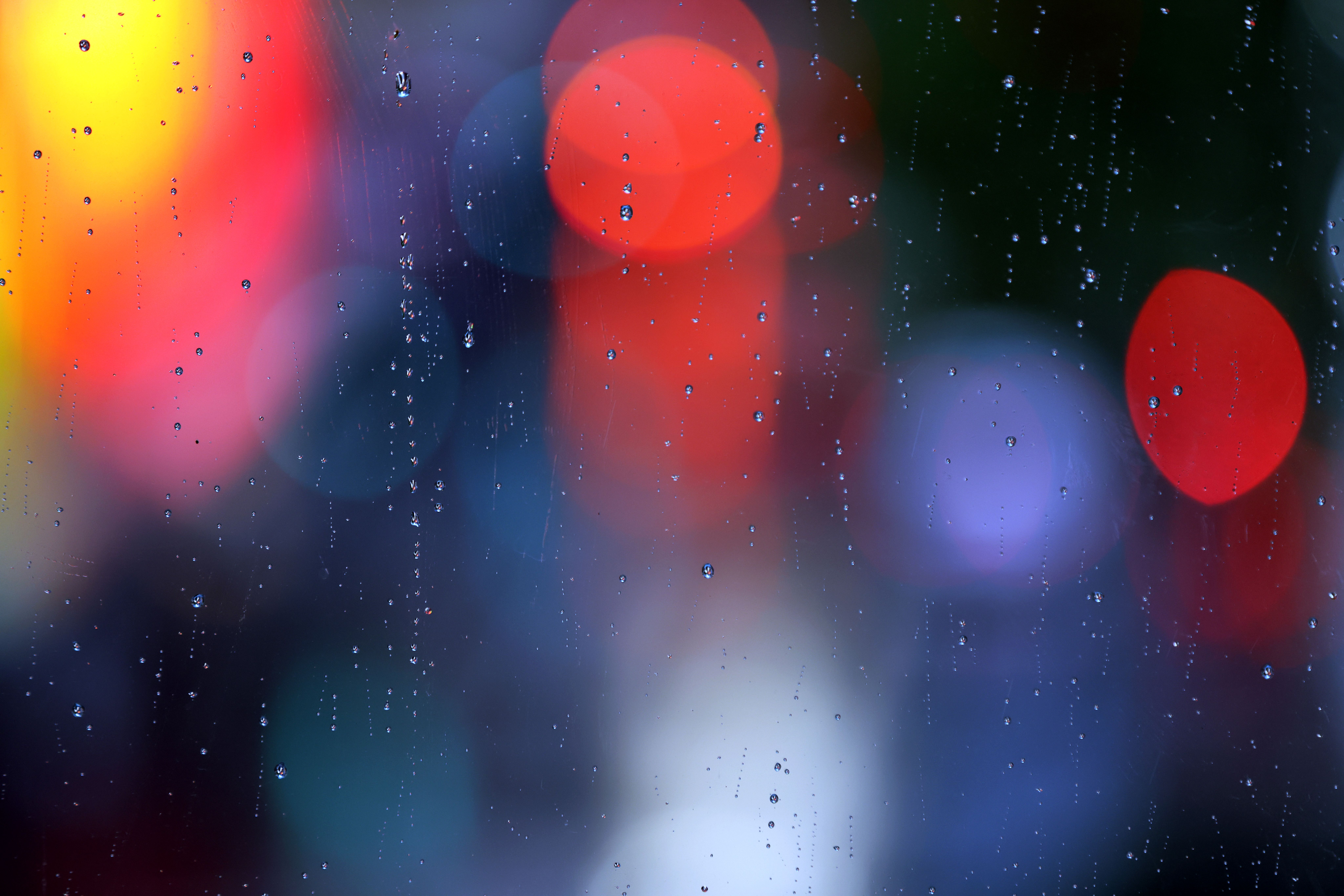 Raindrops on Window with City Lights Bokeh · Free Stock Photo
