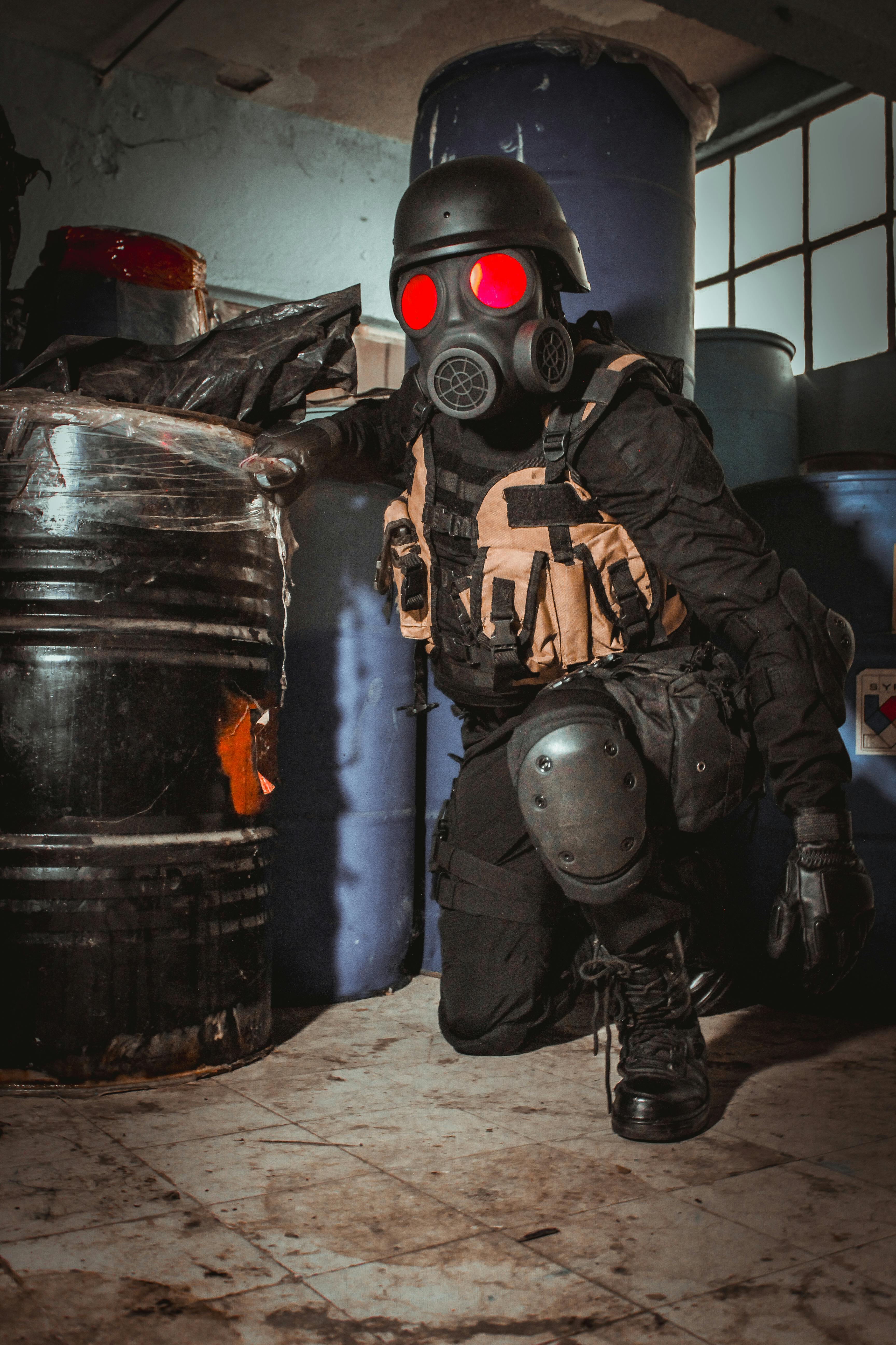 Man Wearing Uniform and Gas Mask in Room · Free Stock Photo
