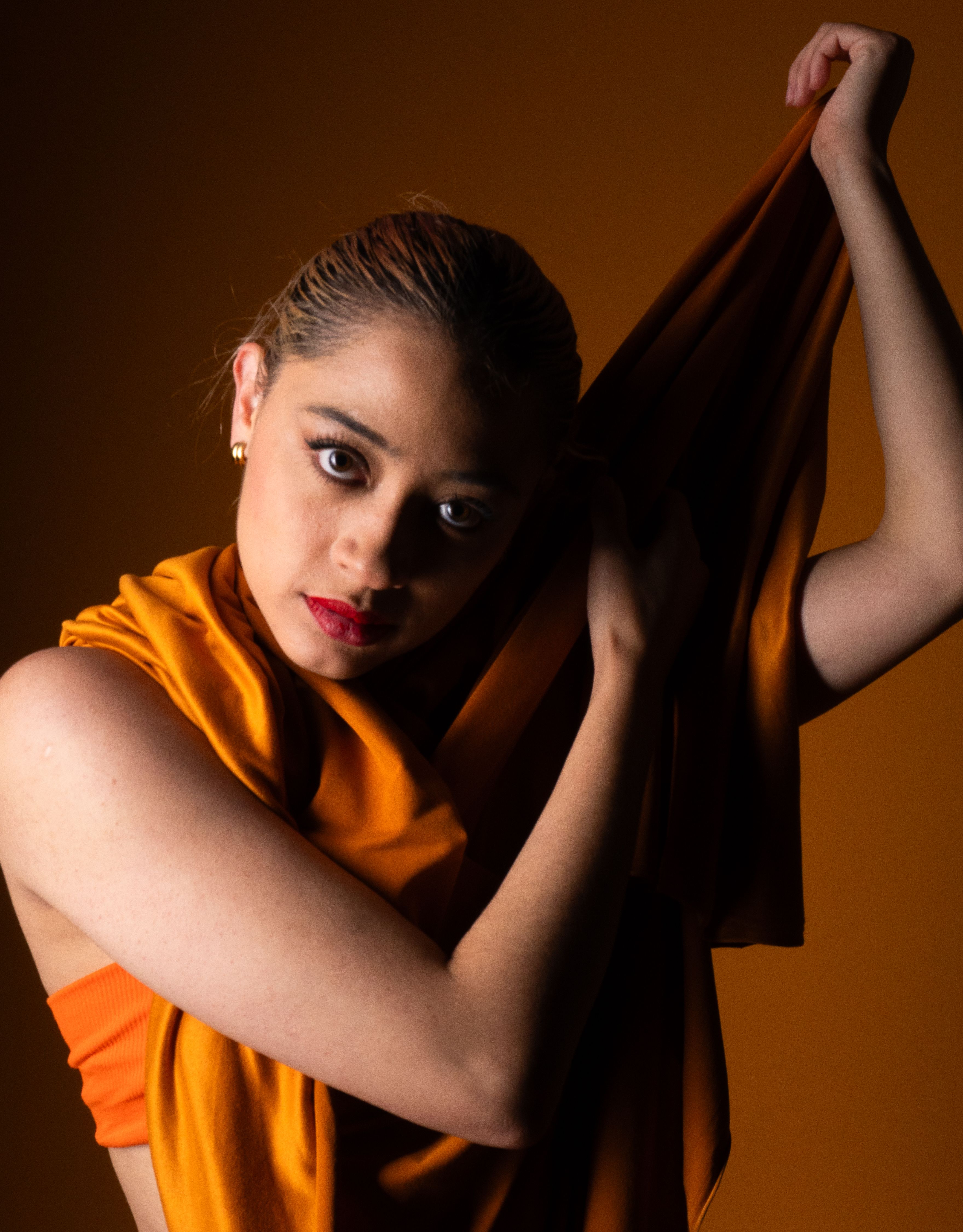 Contemporary Dance Expression in Orange Hue · Free Stock Photo