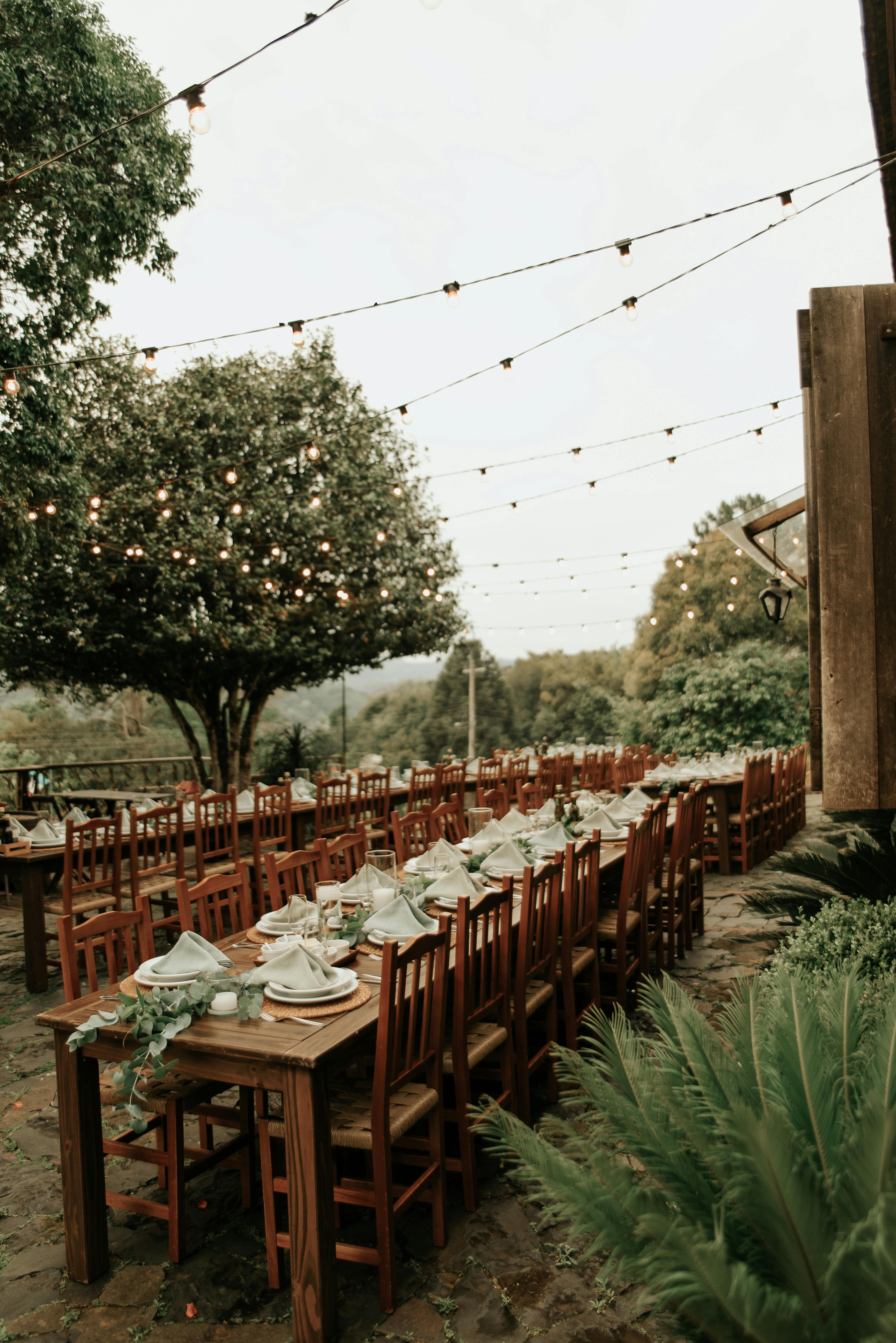 Rustic Outdoor Dining with String Lights Setting · Free Stock Photo