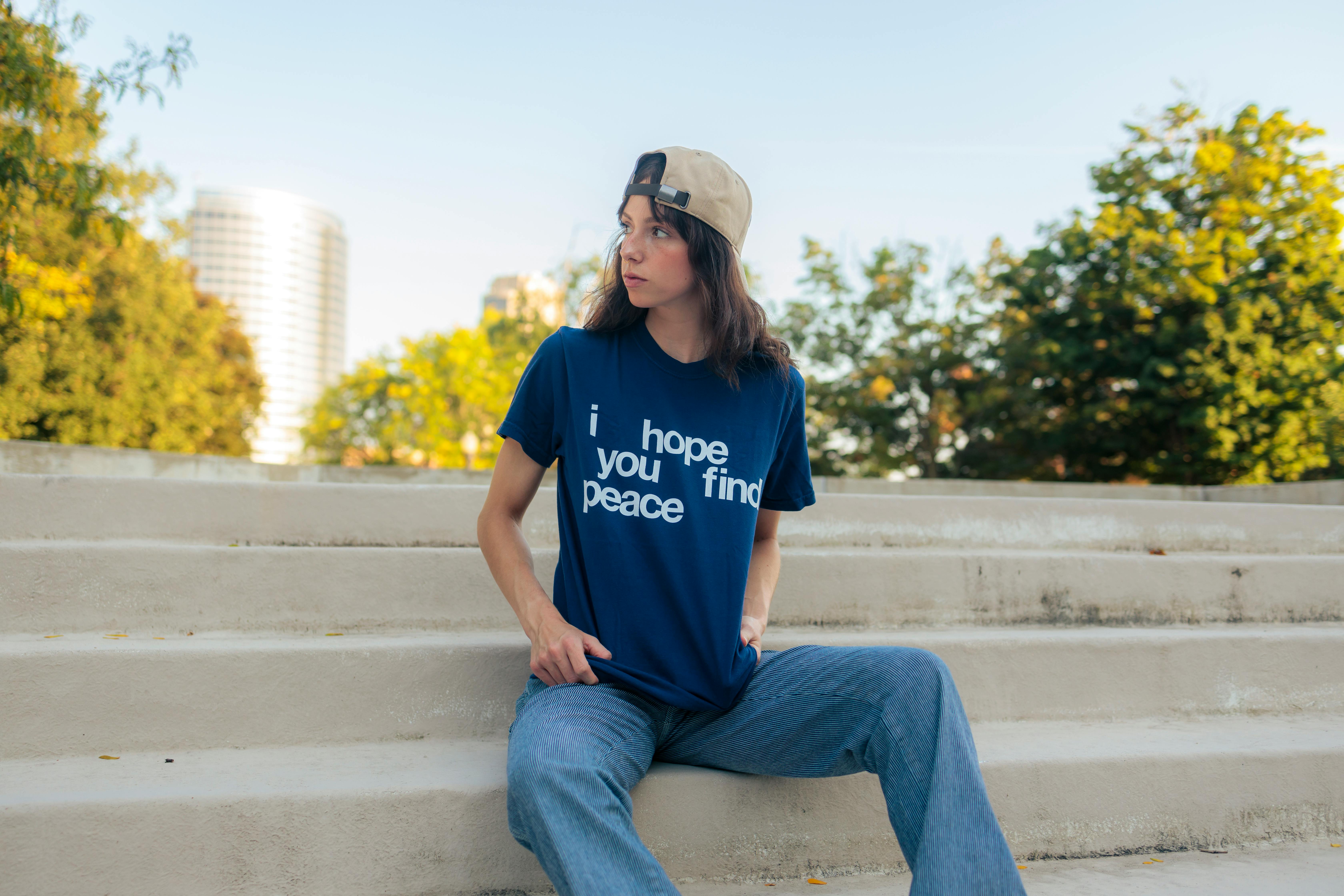 Relaxed Individual on Steps in Urban Park · Free Stock Photo