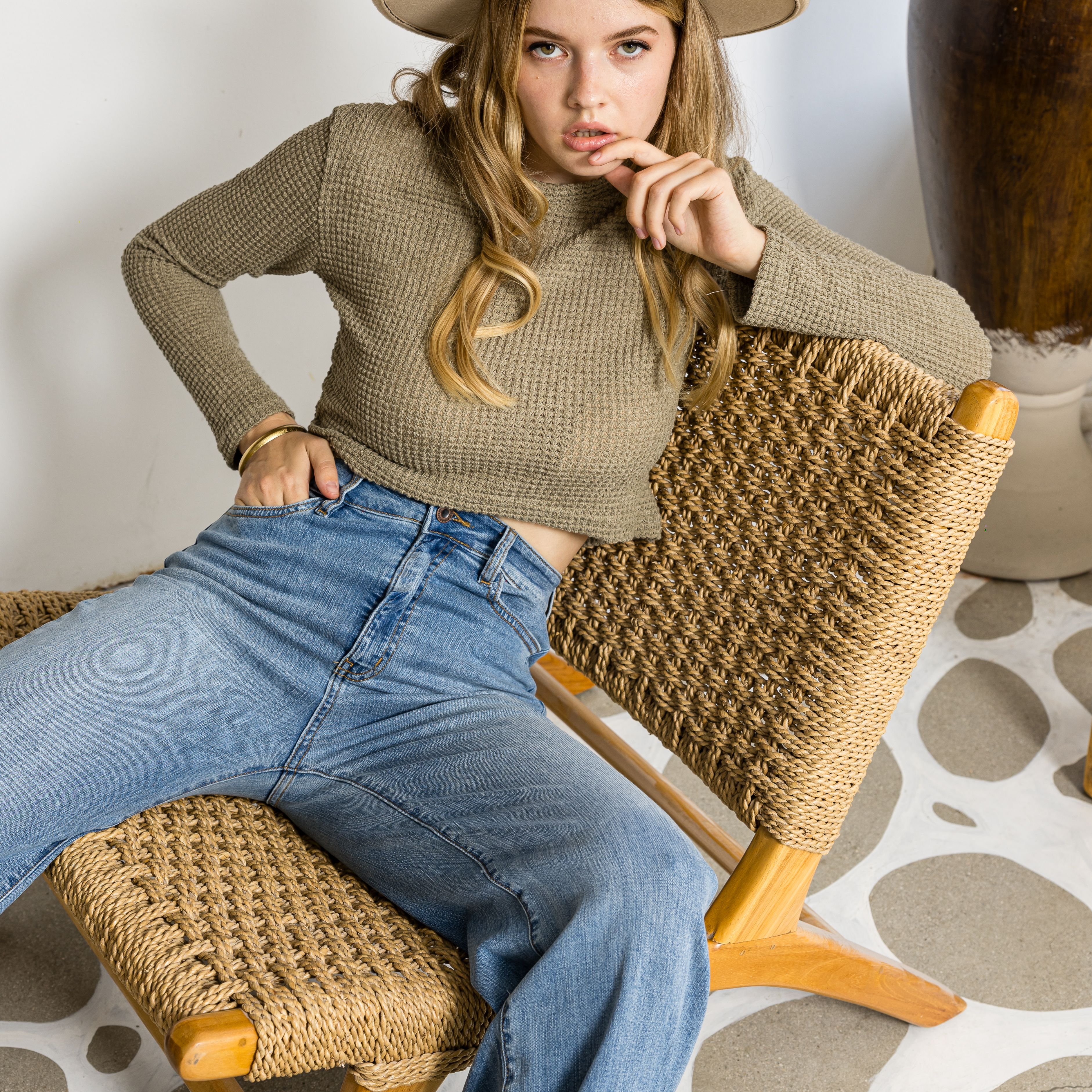 Fashionable Young Woman in Relaxed Pose Indoors · Free Stock Photo