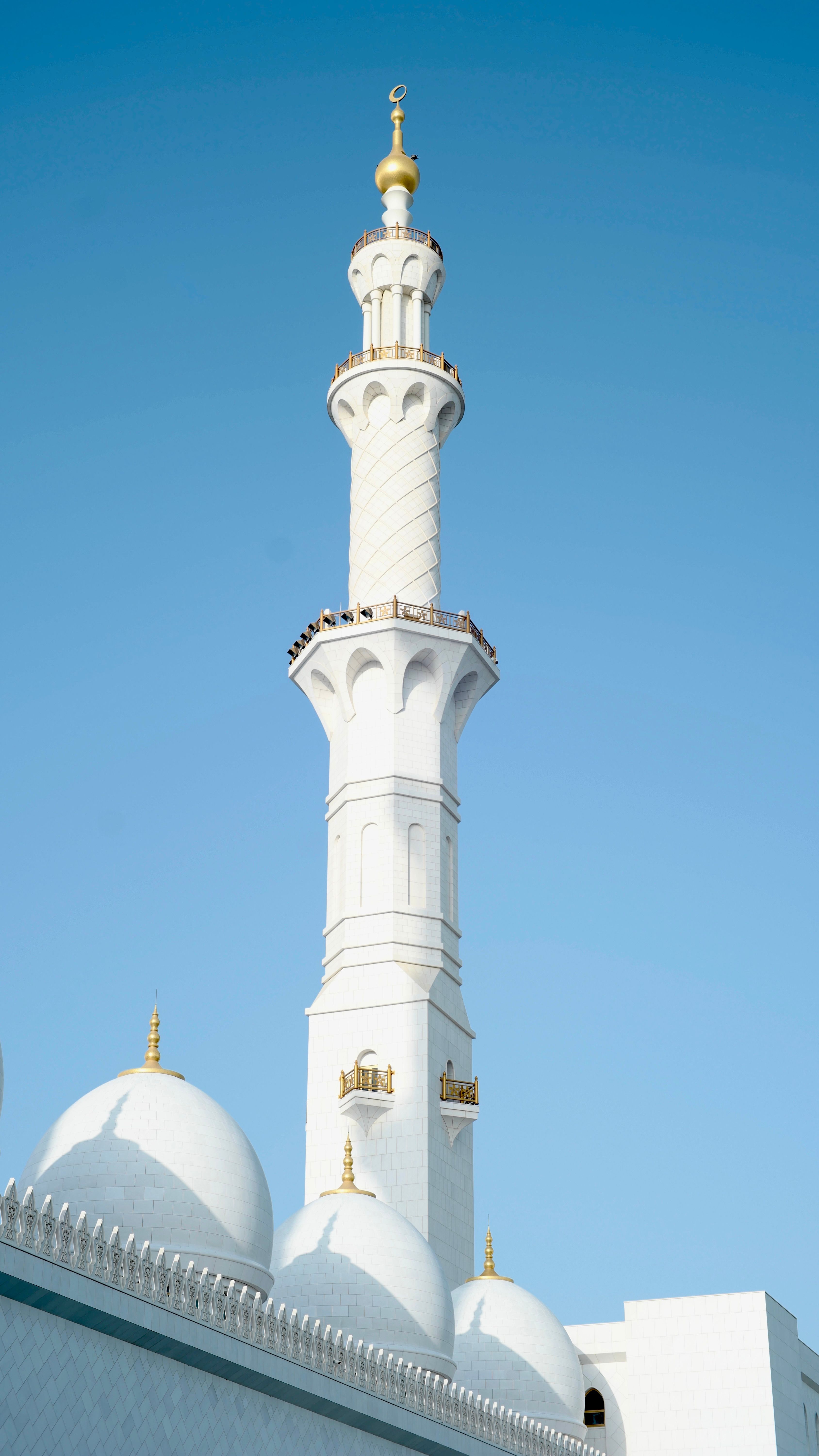 Majestic White Minaret Against Clear Blue Sky · Free Stock Photo