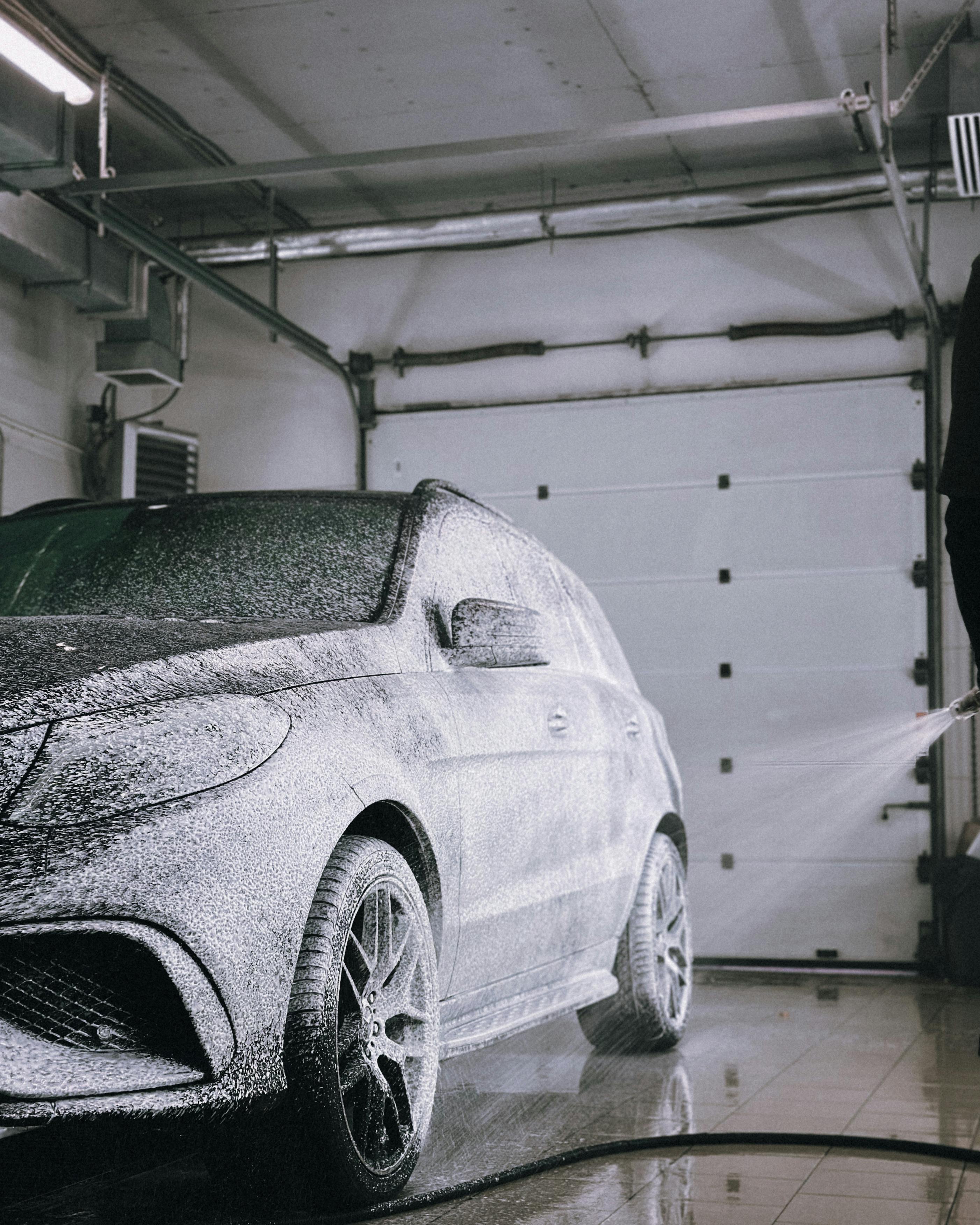 Luxury Car Being Washed in Garage · Free Stock Photo