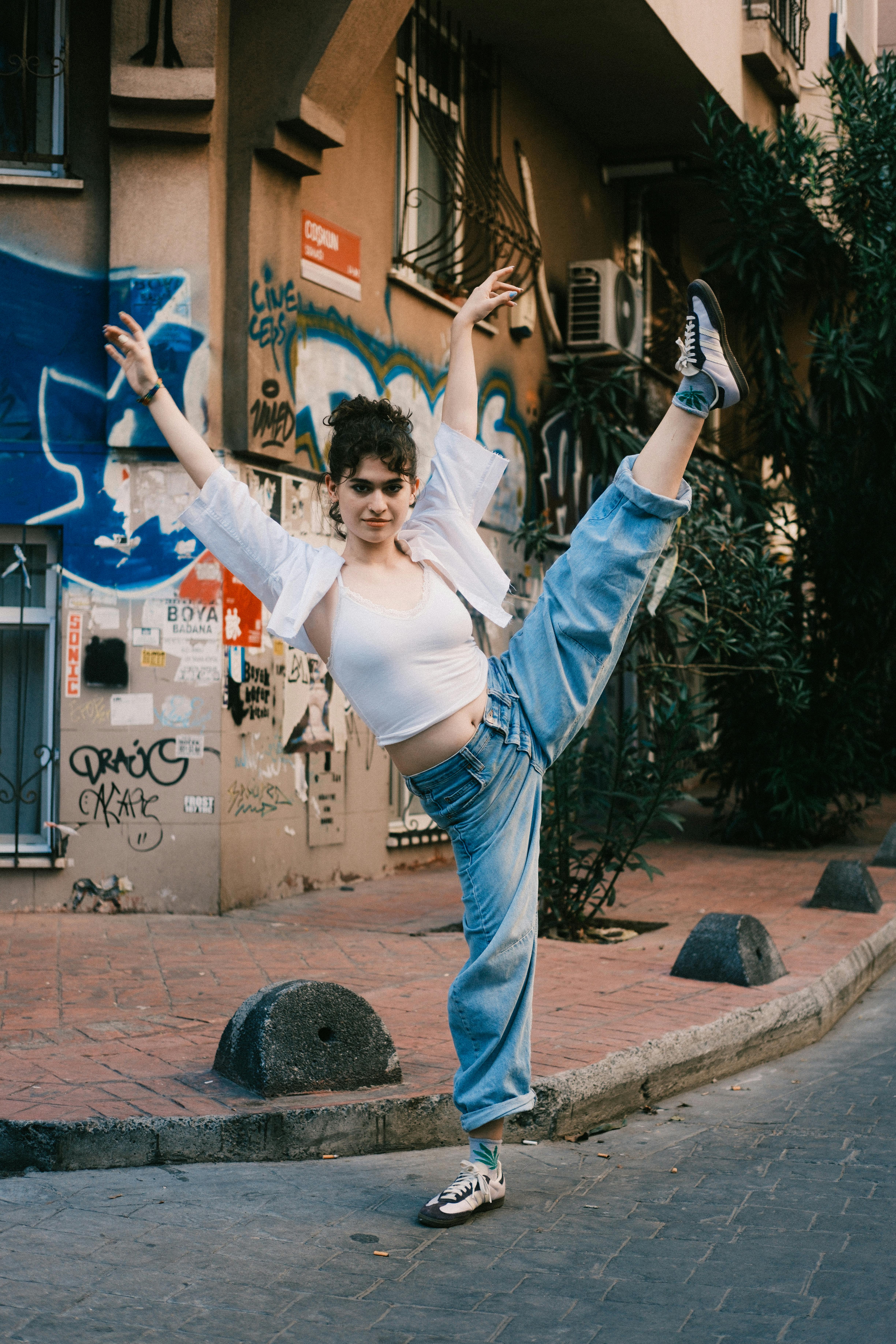 Street Dancer Performing High Kick Outdoors · Free Stock Photo