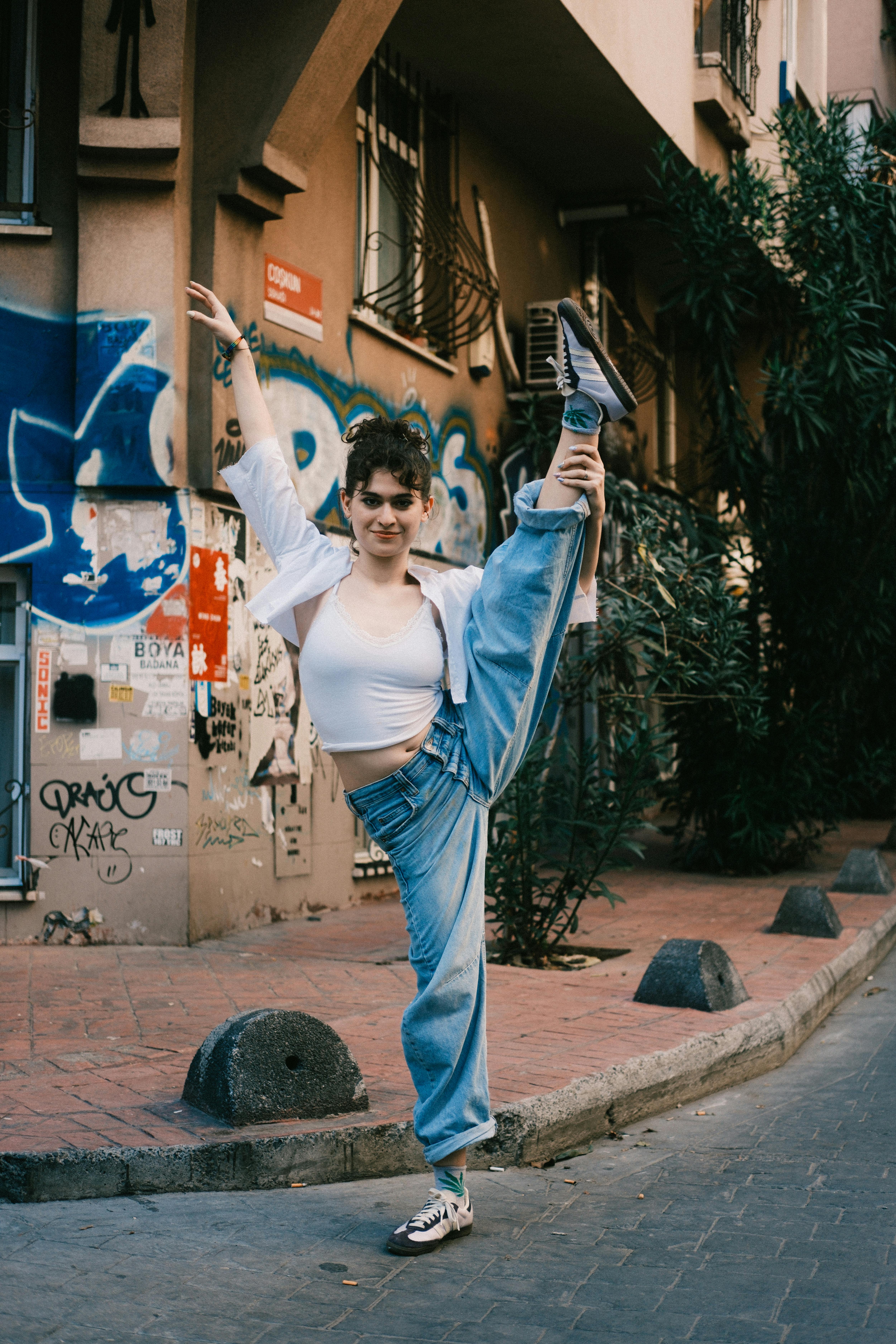 Young Dancer in Dynamic Urban Street Pose · Free Stock Photo