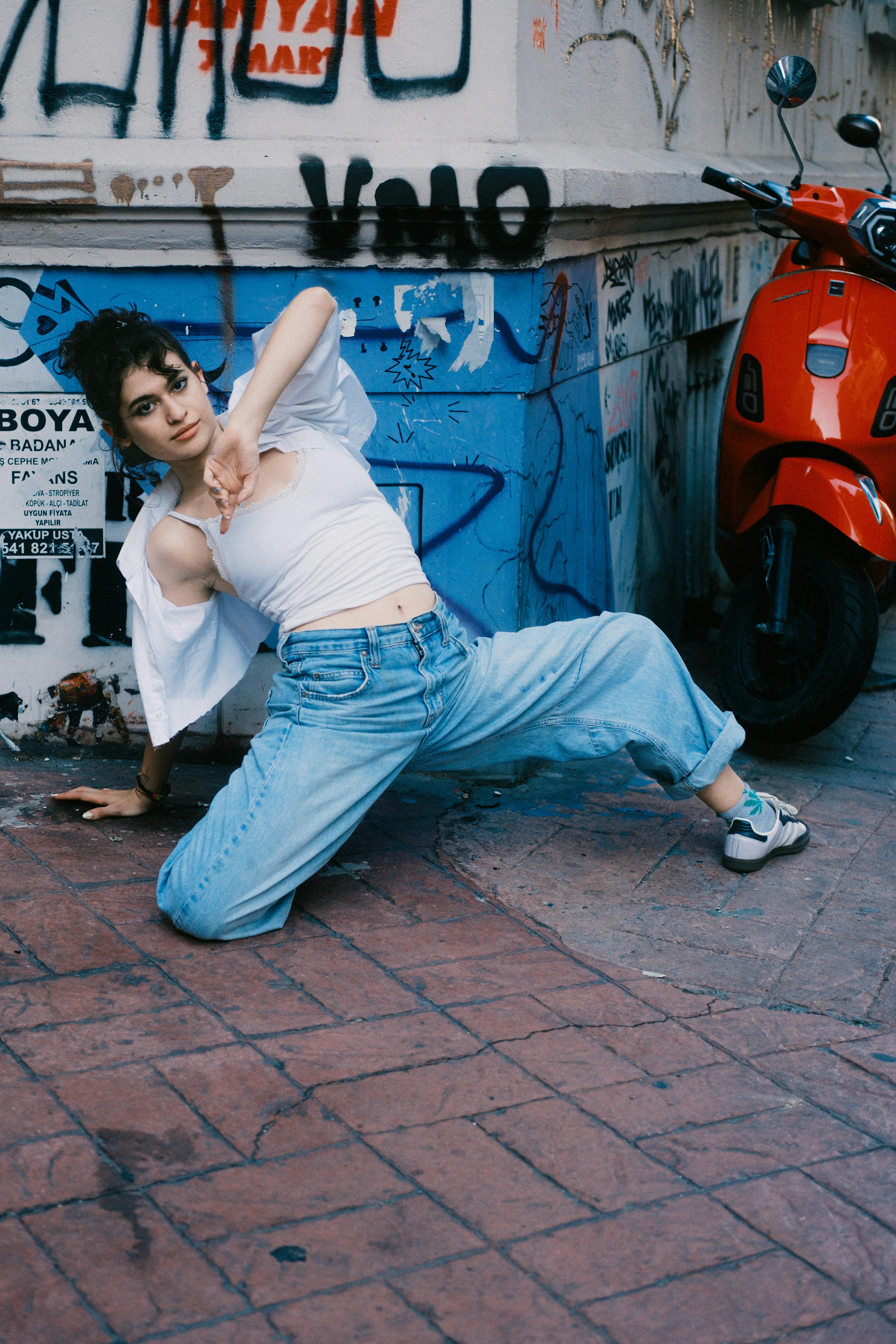 Urban Dance Pose in Graffiti Alley Setting · Free Stock Photo