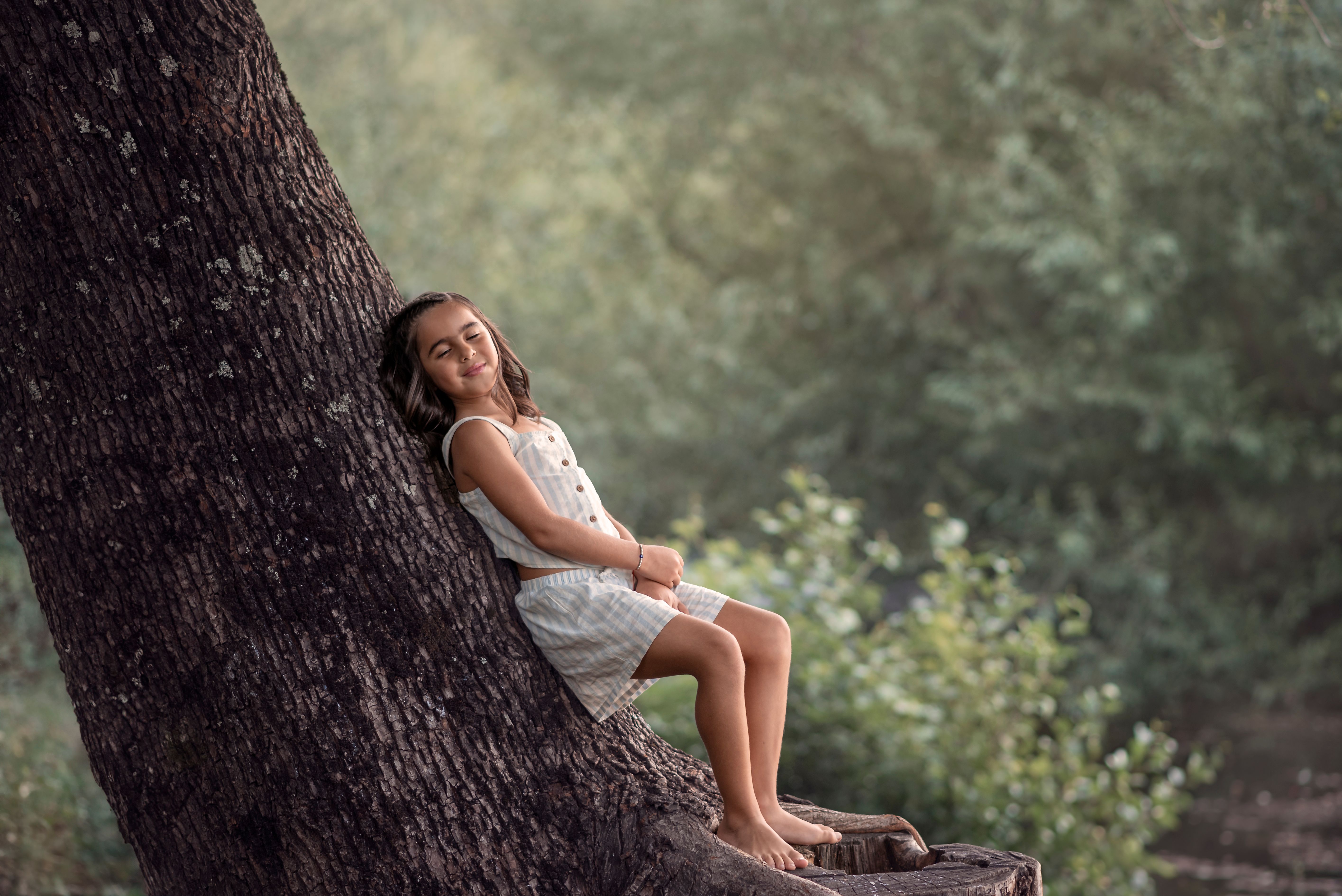 Serene Childhood Moment Under a Tree · Free Stock Photo