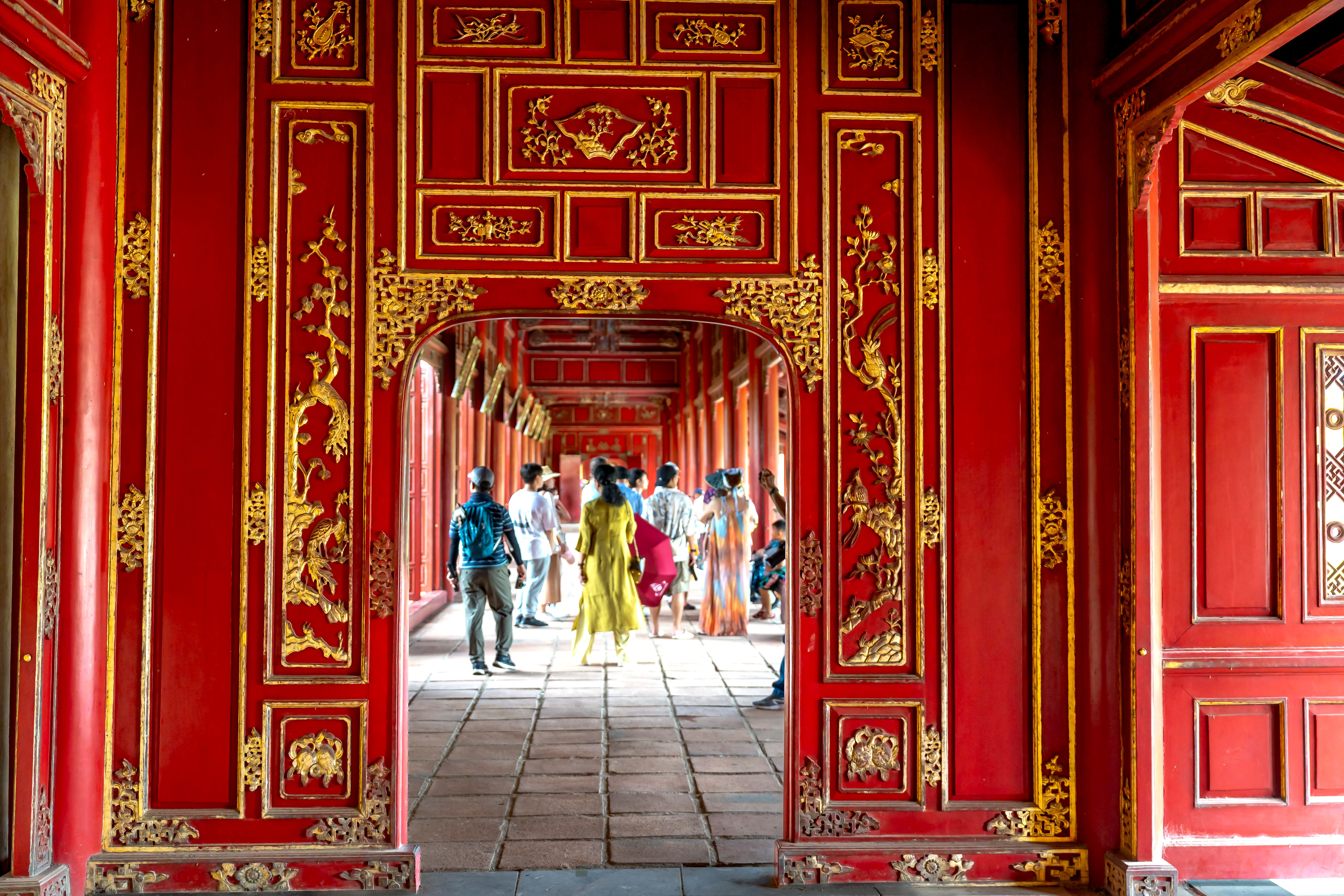 Ornate Red Interior Hallway with Visitors · Free Stock Photo