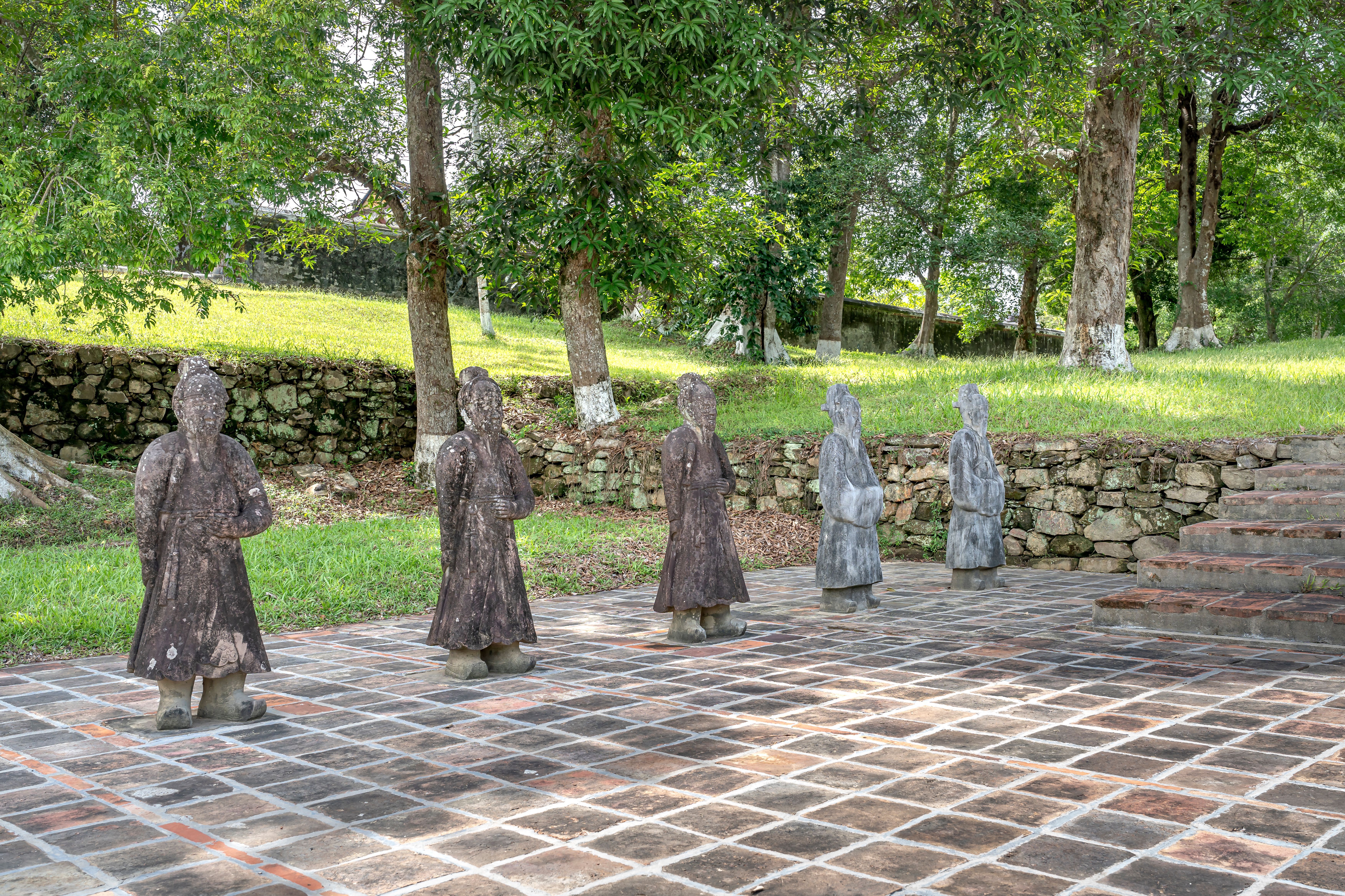 Stone Statues in Tranquil Park Setting · Free Stock Photo
