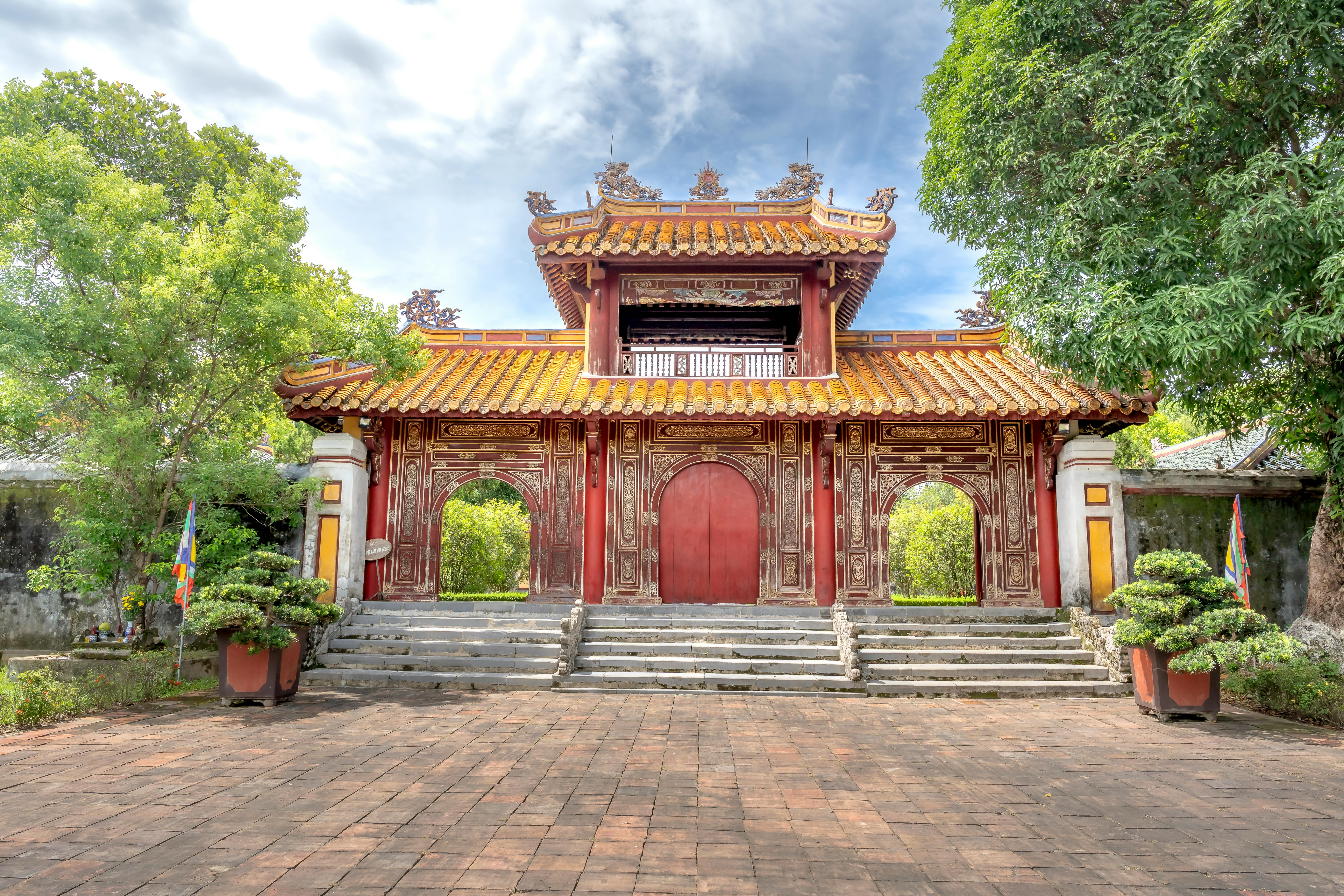 Historic Vietnamese Temple Gate under Blue Sky · Free Stock Photo