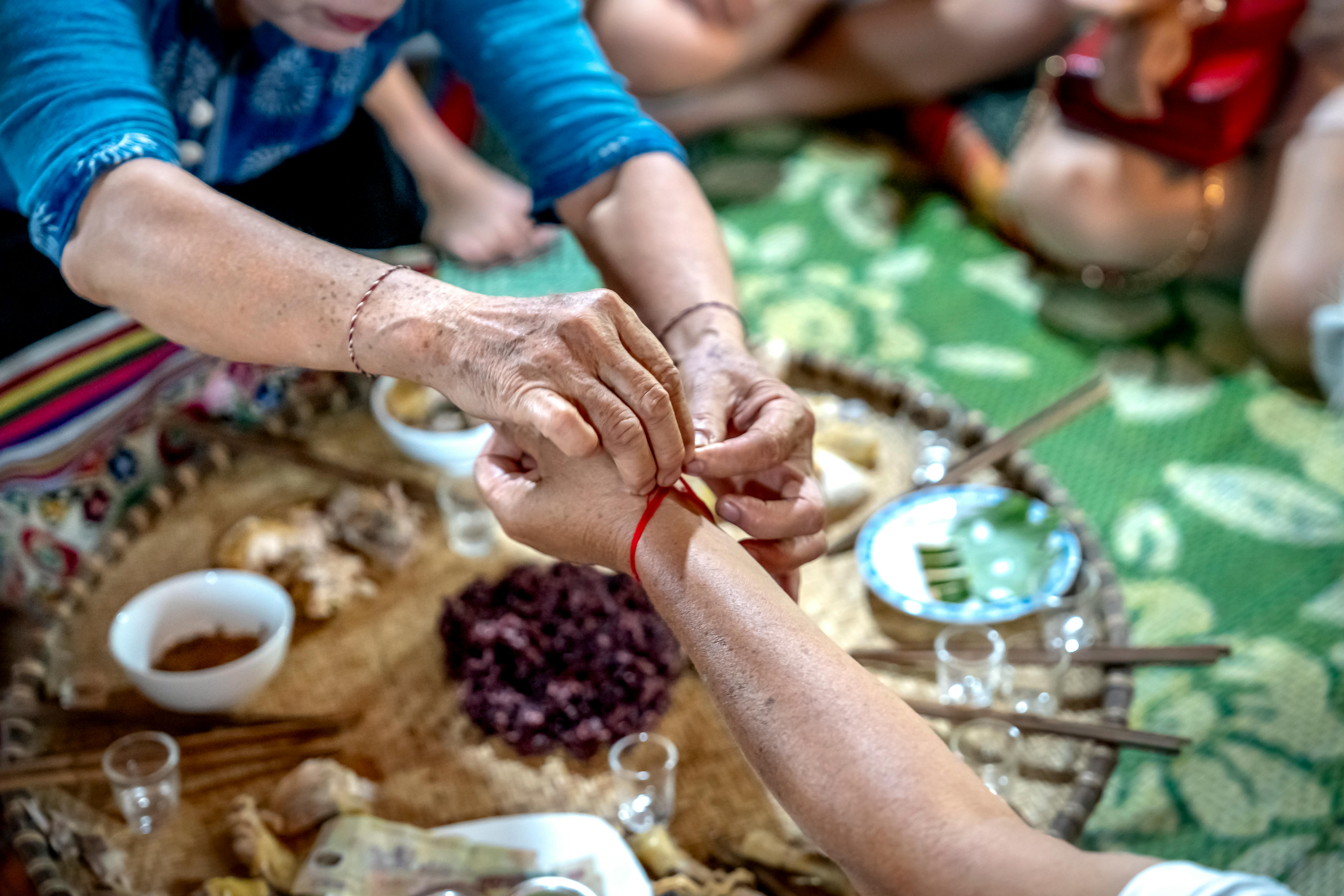 Traditional Ceremony with Red Thread Ritual · Free Stock Photo