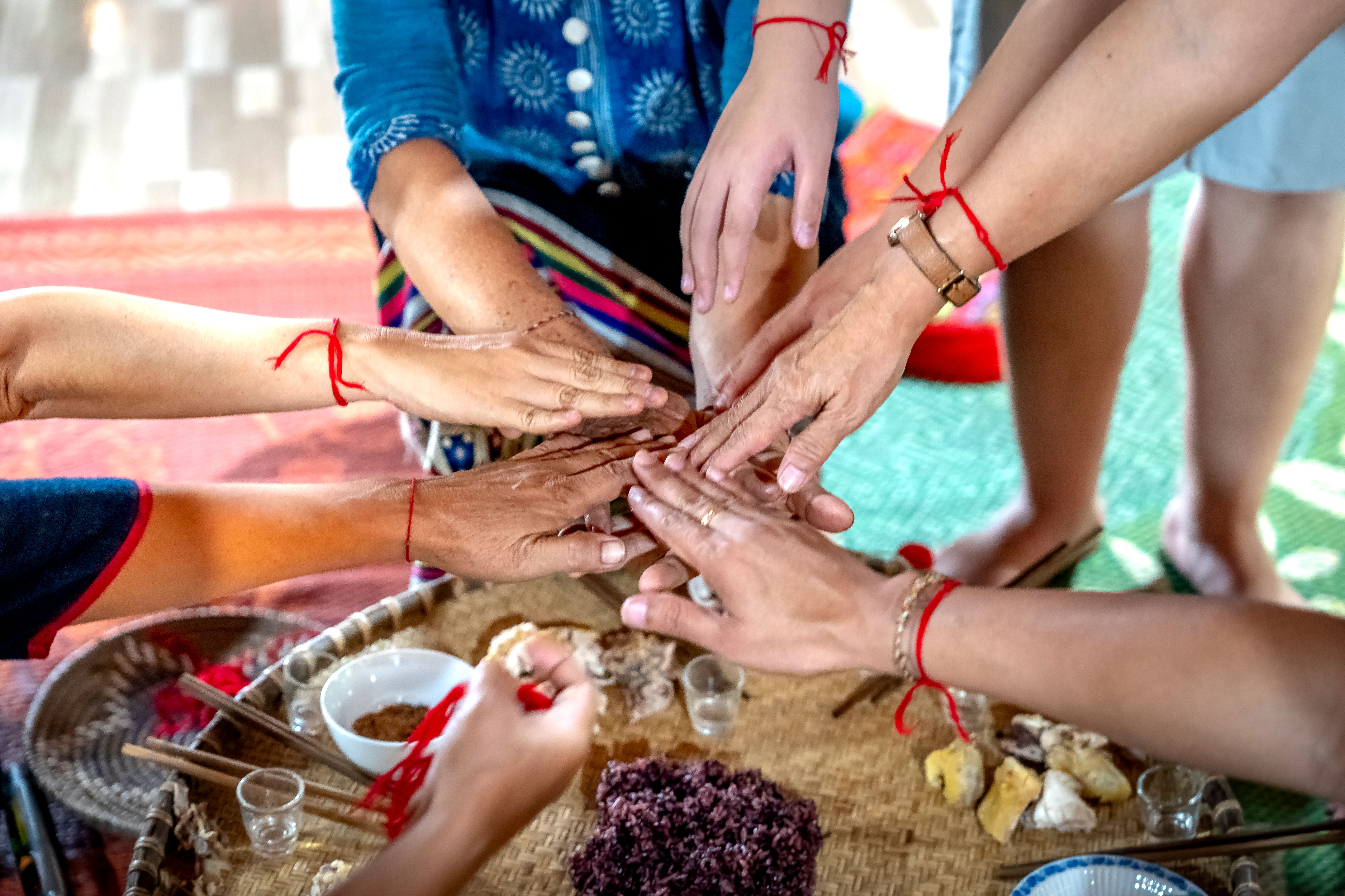 Traditional Ceremony with Red Bracelets and Hands Together · Free Stock ...