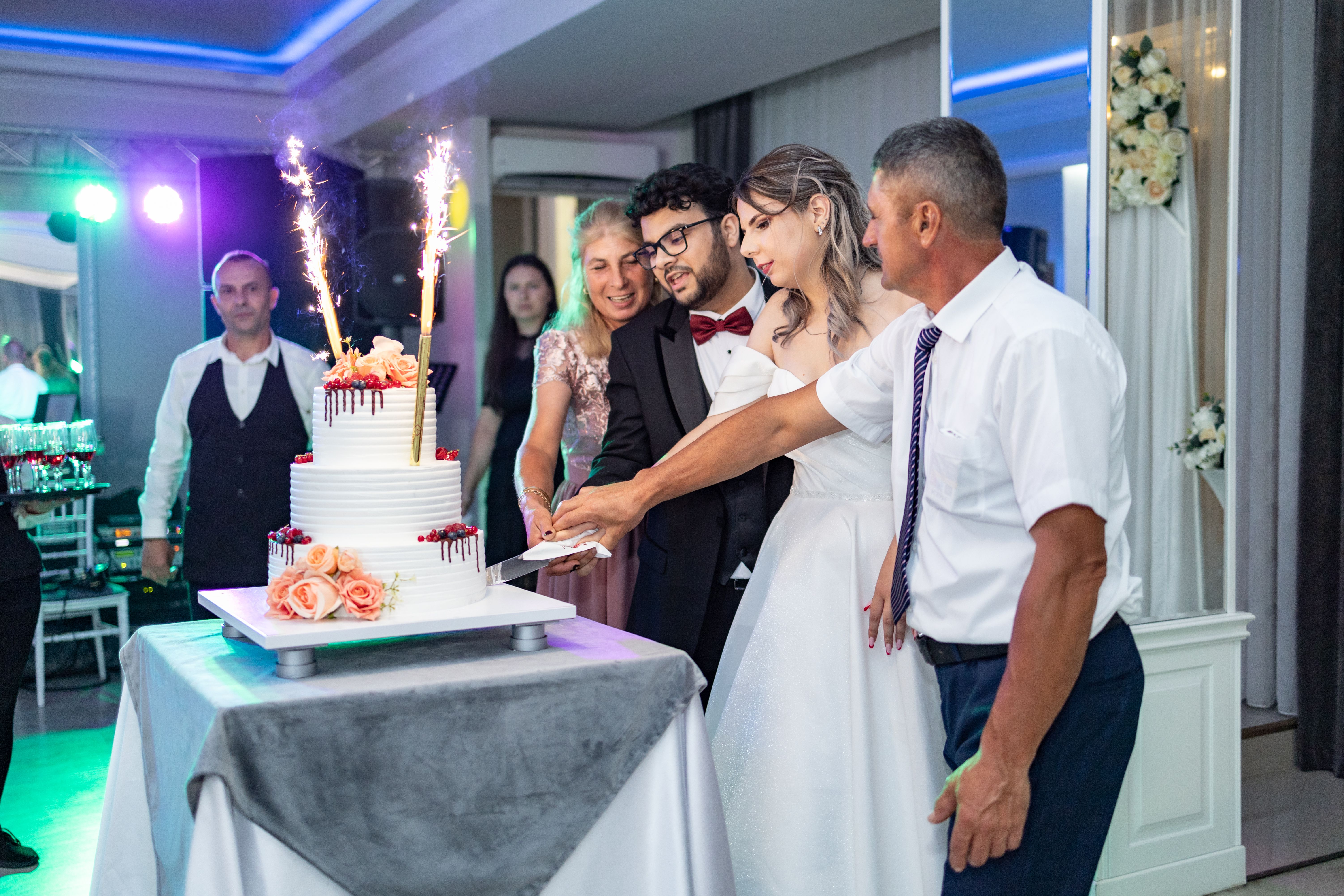 Elegant Wedding Cake Cutting Ceremony Celebration · Free Stock Photo