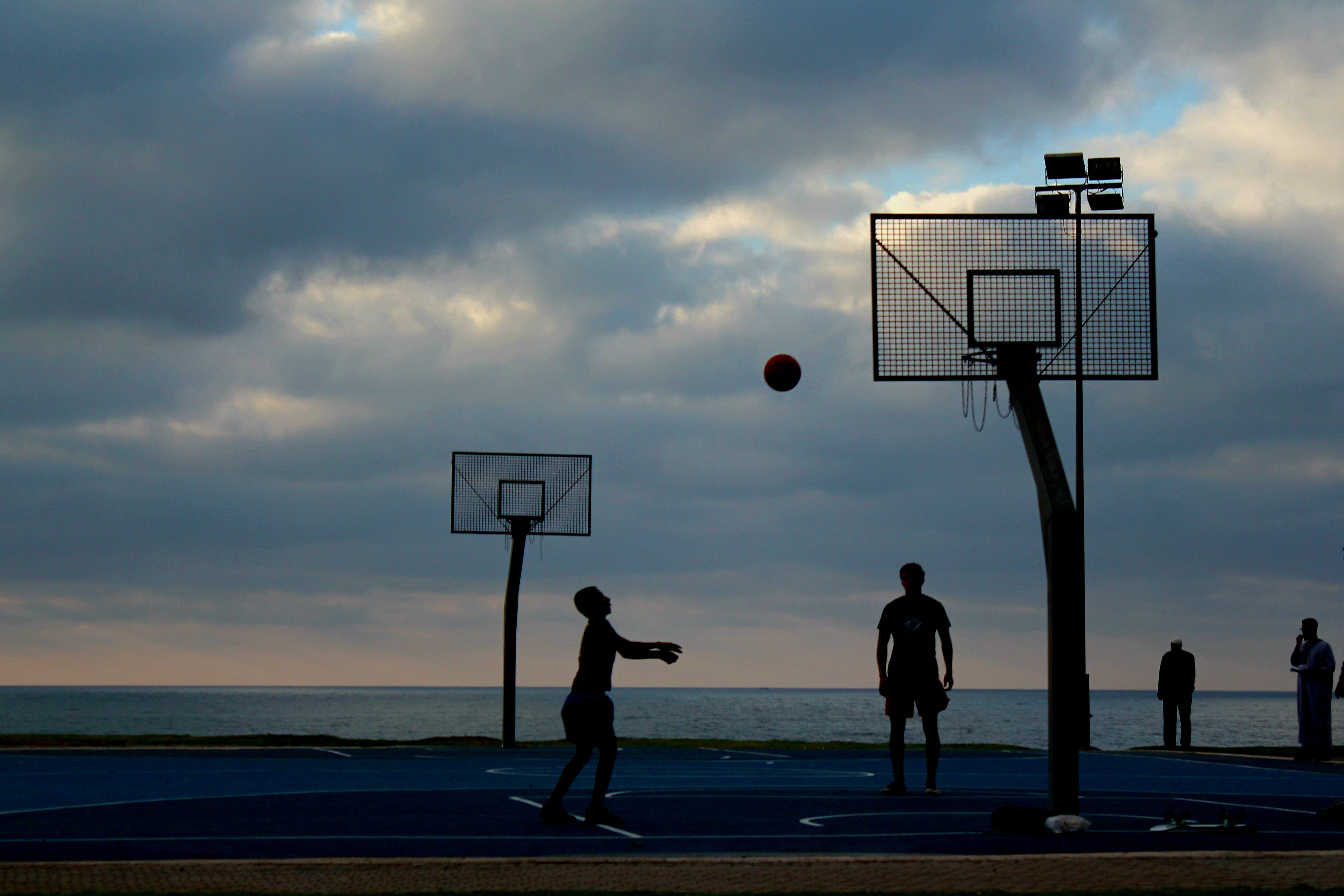 People Playing Ball in Grey Sound · Free Stock Photo