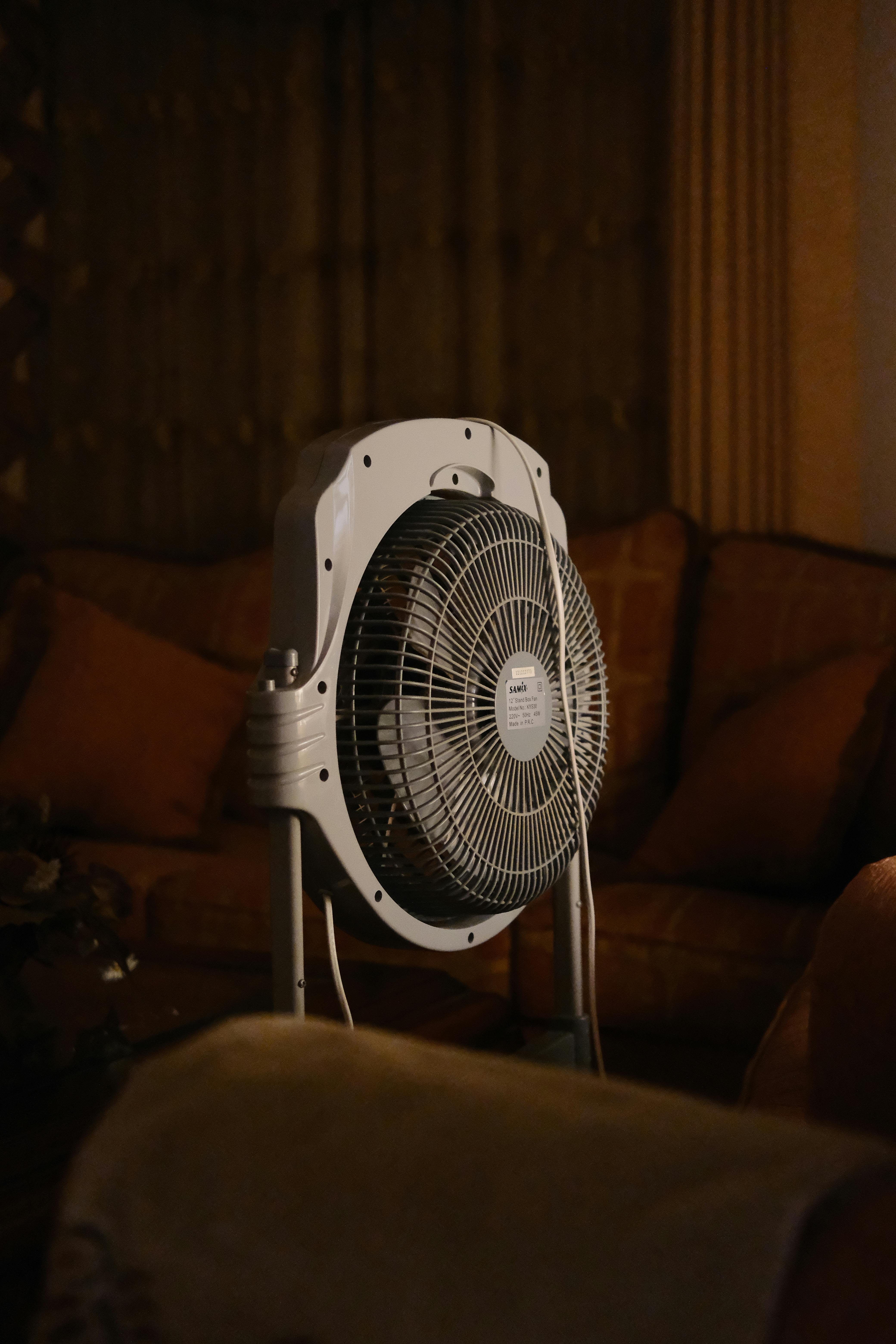 Classic Electric Fan in Cozy Living Room Setting · Free Stock Photo
