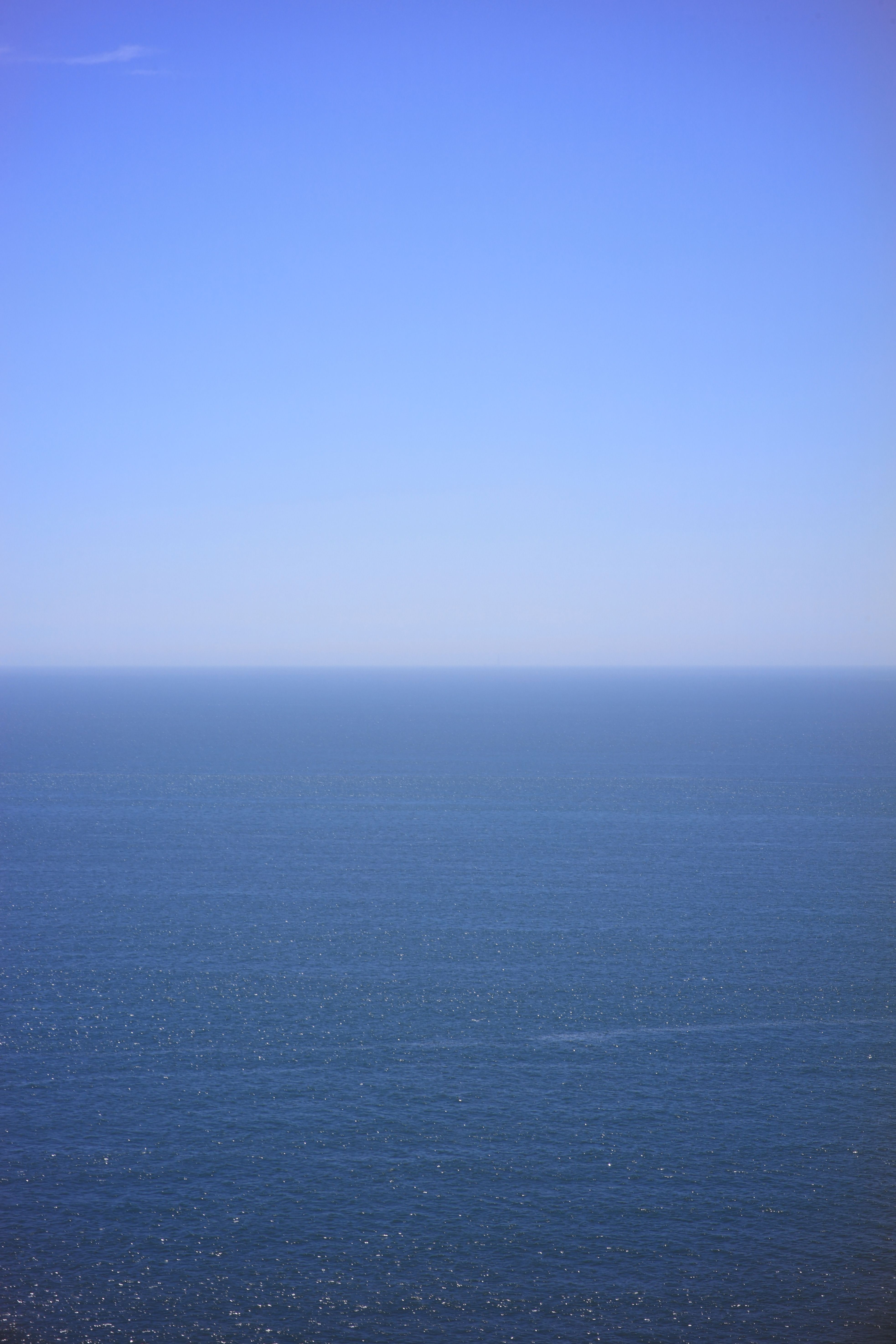 Tranquil Deep Blue Ocean Under Clear Sky · Free Stock Photo