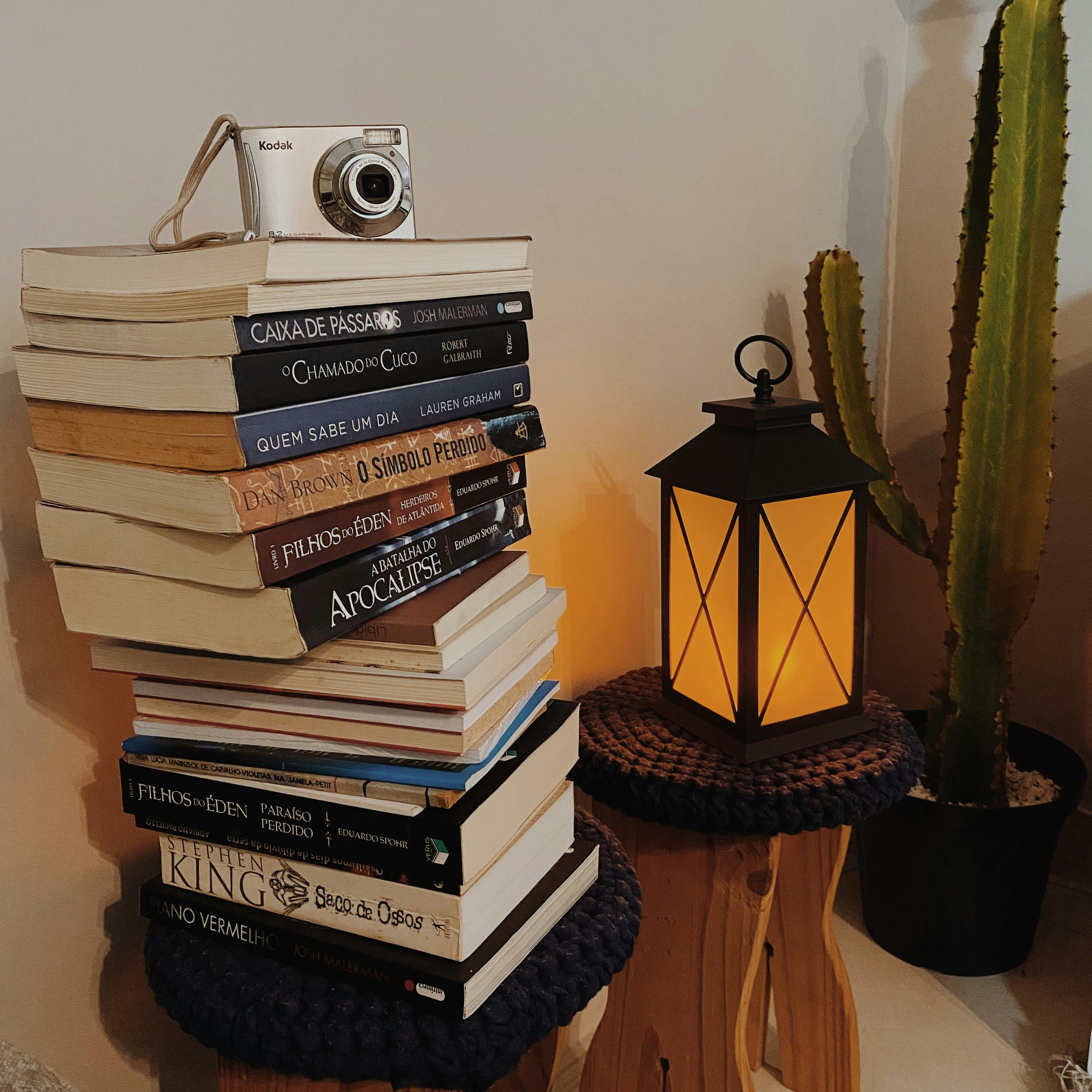 Cozy Home Decor with Books and Lantern · Free Stock Photo