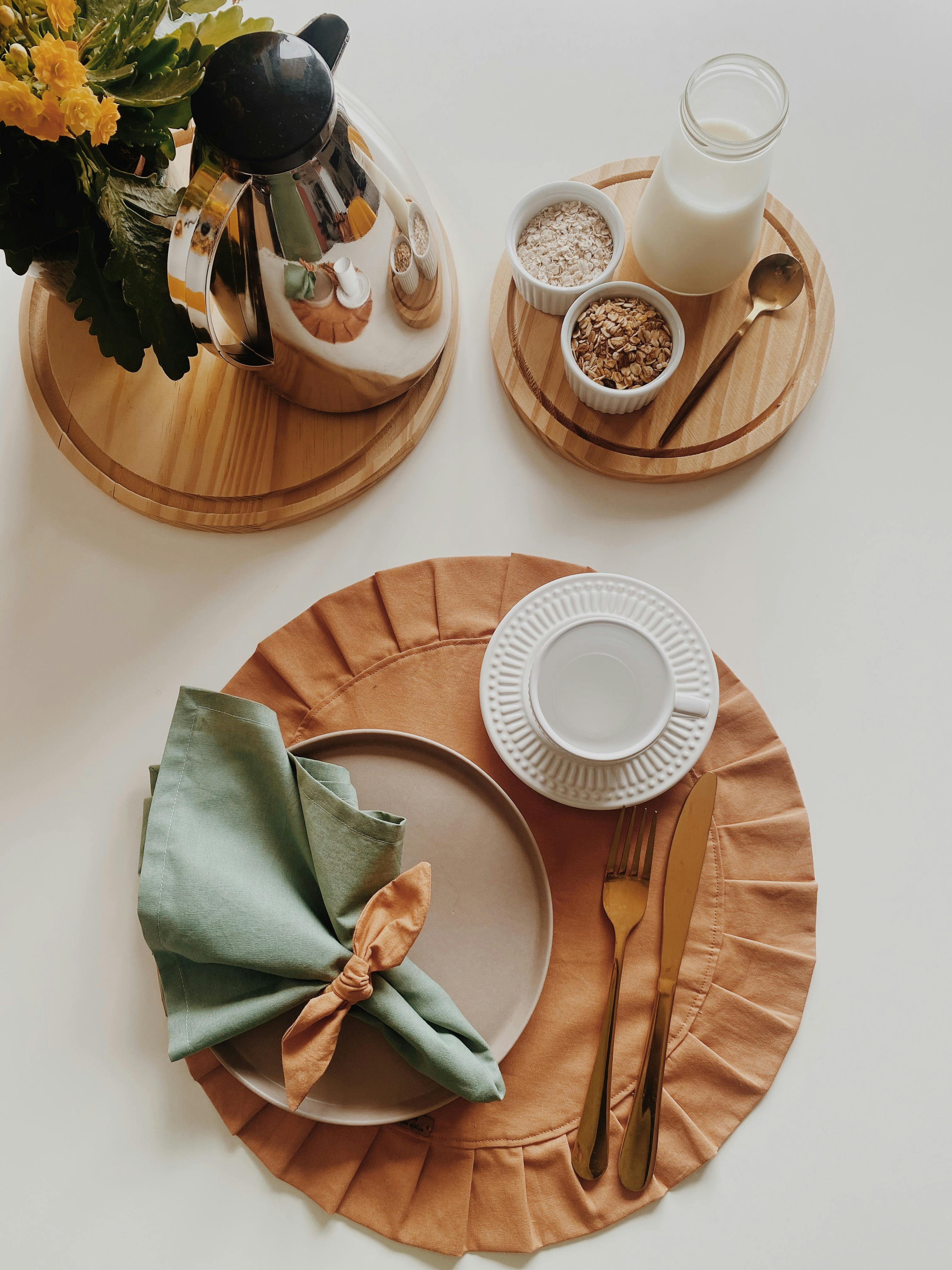 Elegant Breakfast Setting with Golden Utensils · Free Stock Photo