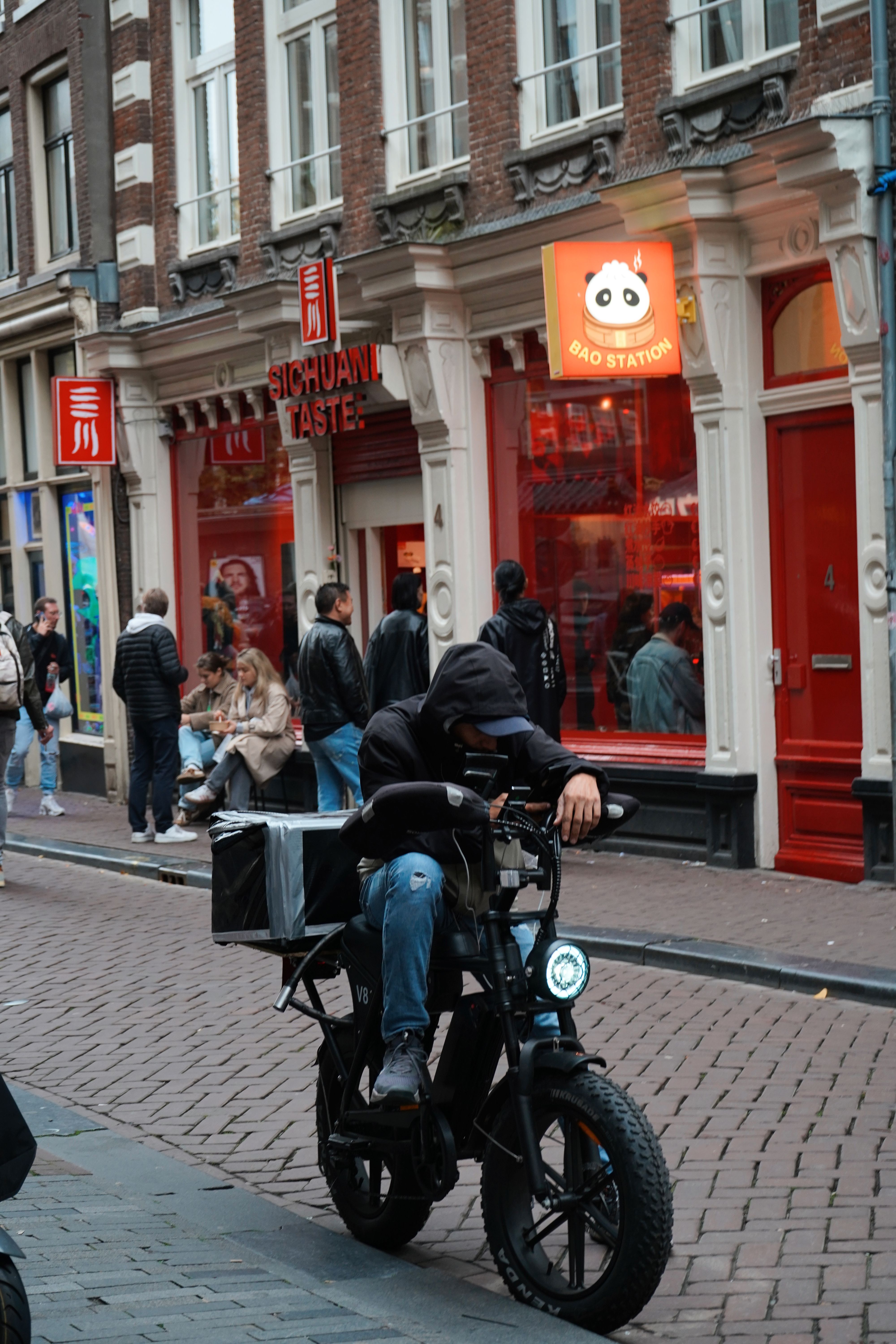 Street Life with Electric Scooter in Urban Setting · Free Stock Photo