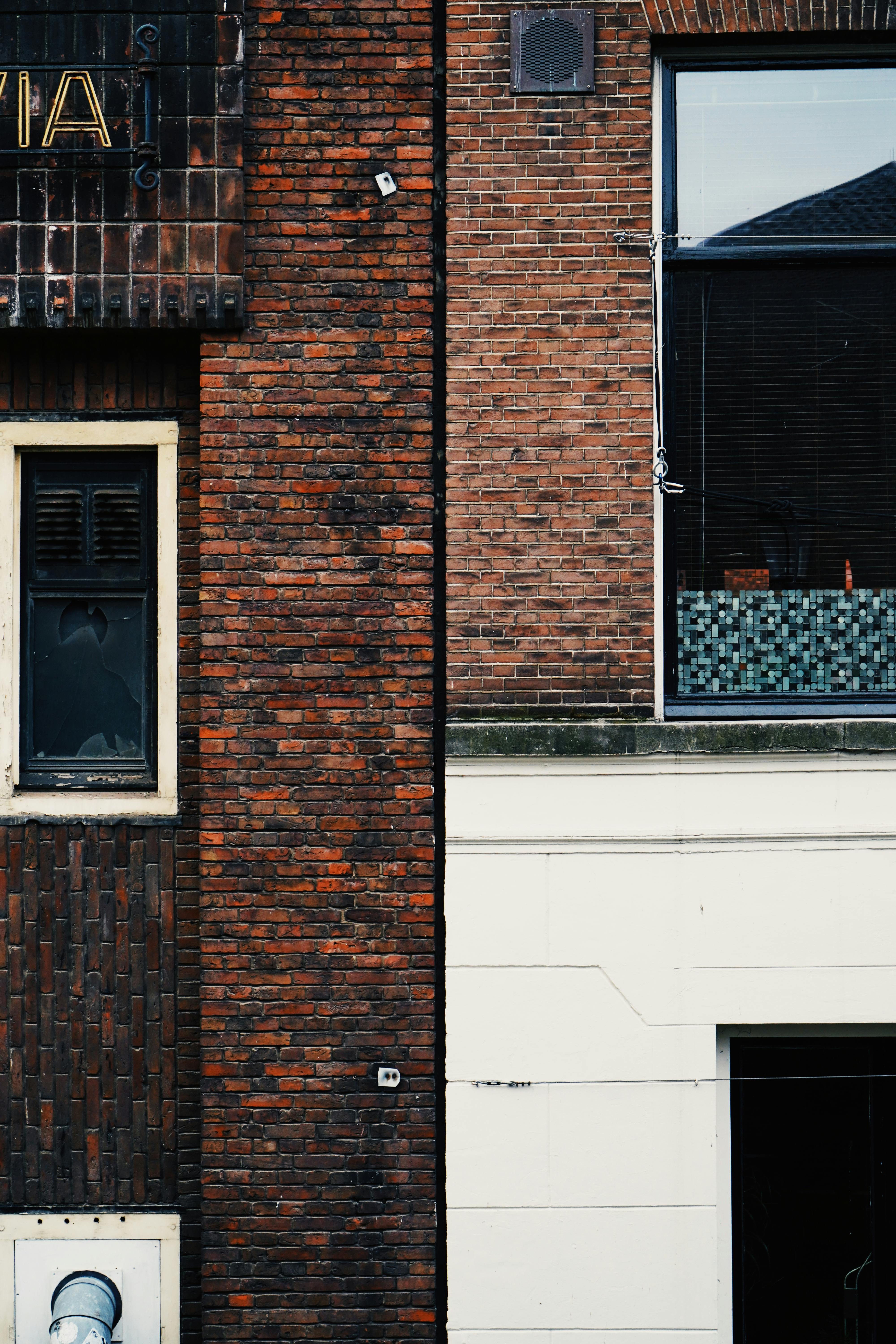 Contrast of Classic and Modern Brick Architecture · Free Stock Photo
