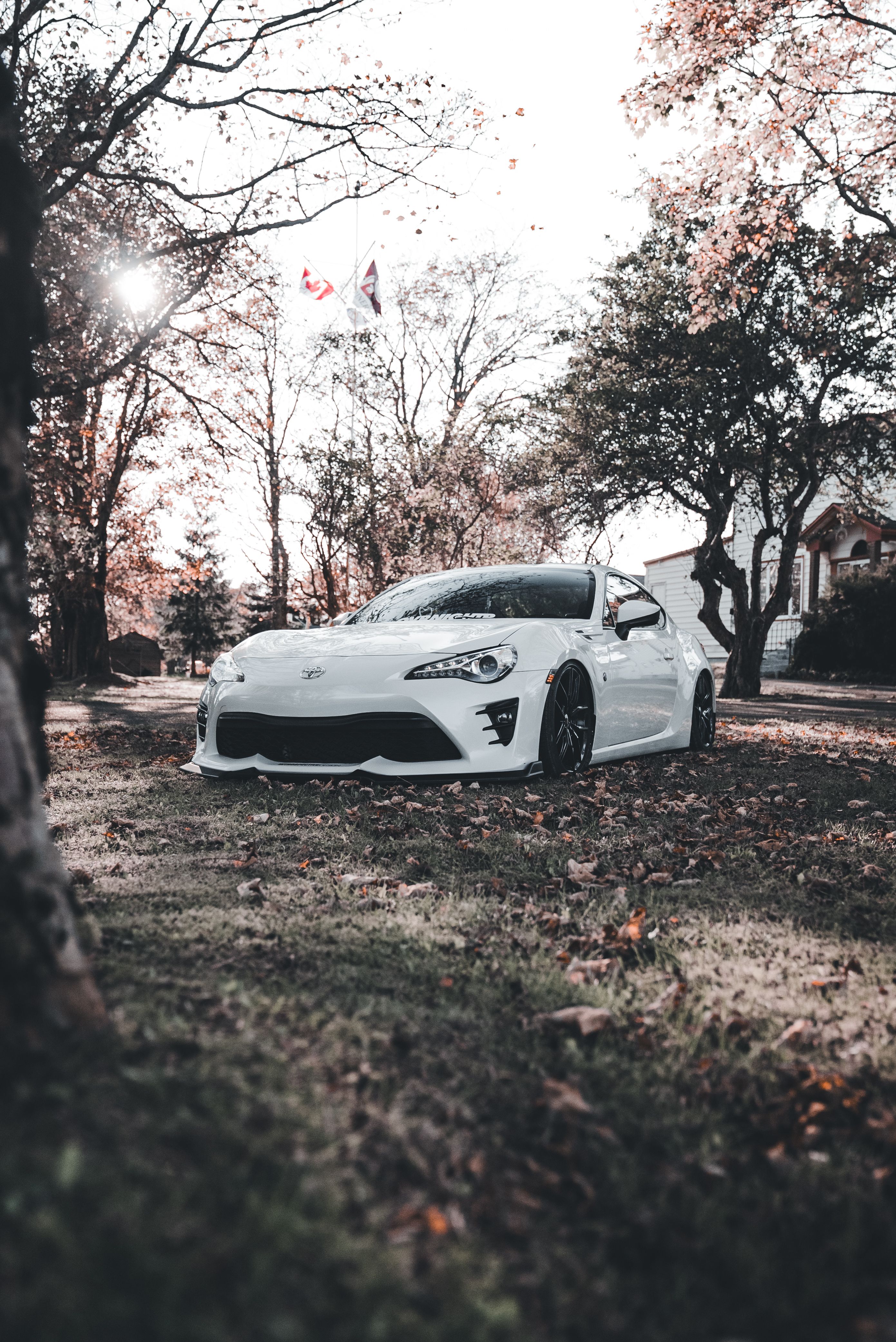 Modern automobile driving on countryside road in autumn · Free Stock Photo