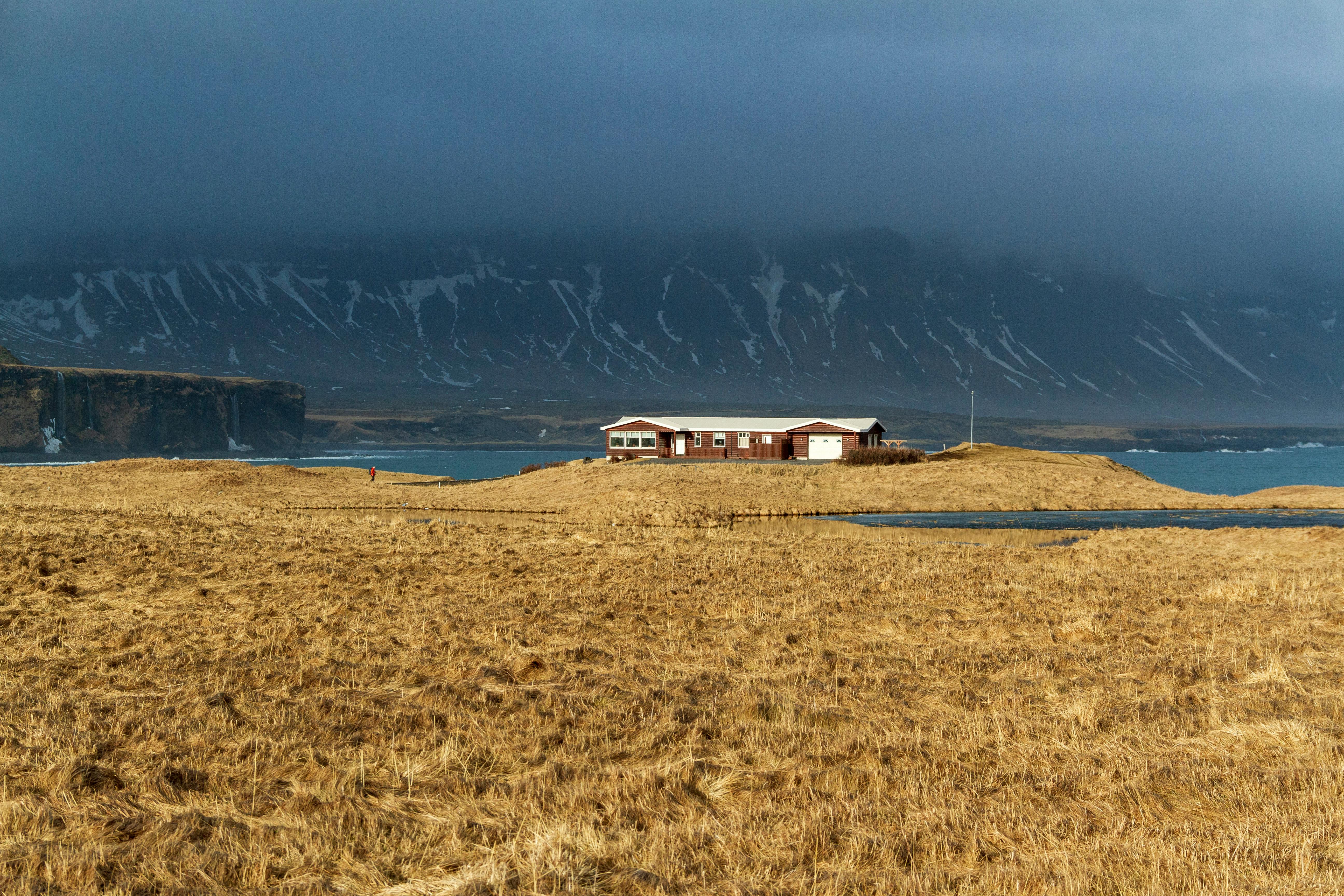Remote House in Icelandic Landscape under Dark Sky · Free Stock Photo