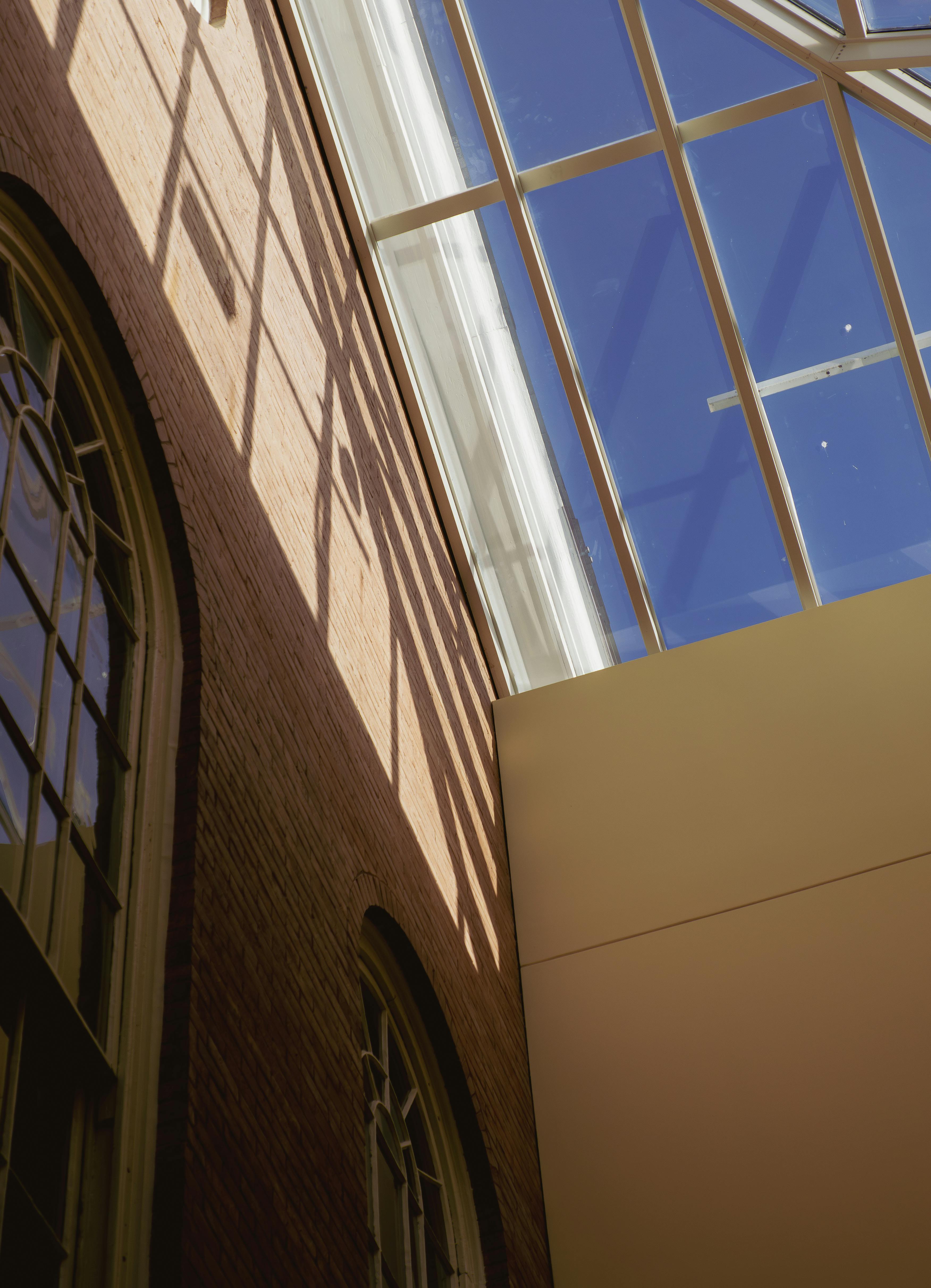Sunlit Architectural Atrium with Glass Ceiling · Free Stock Photo