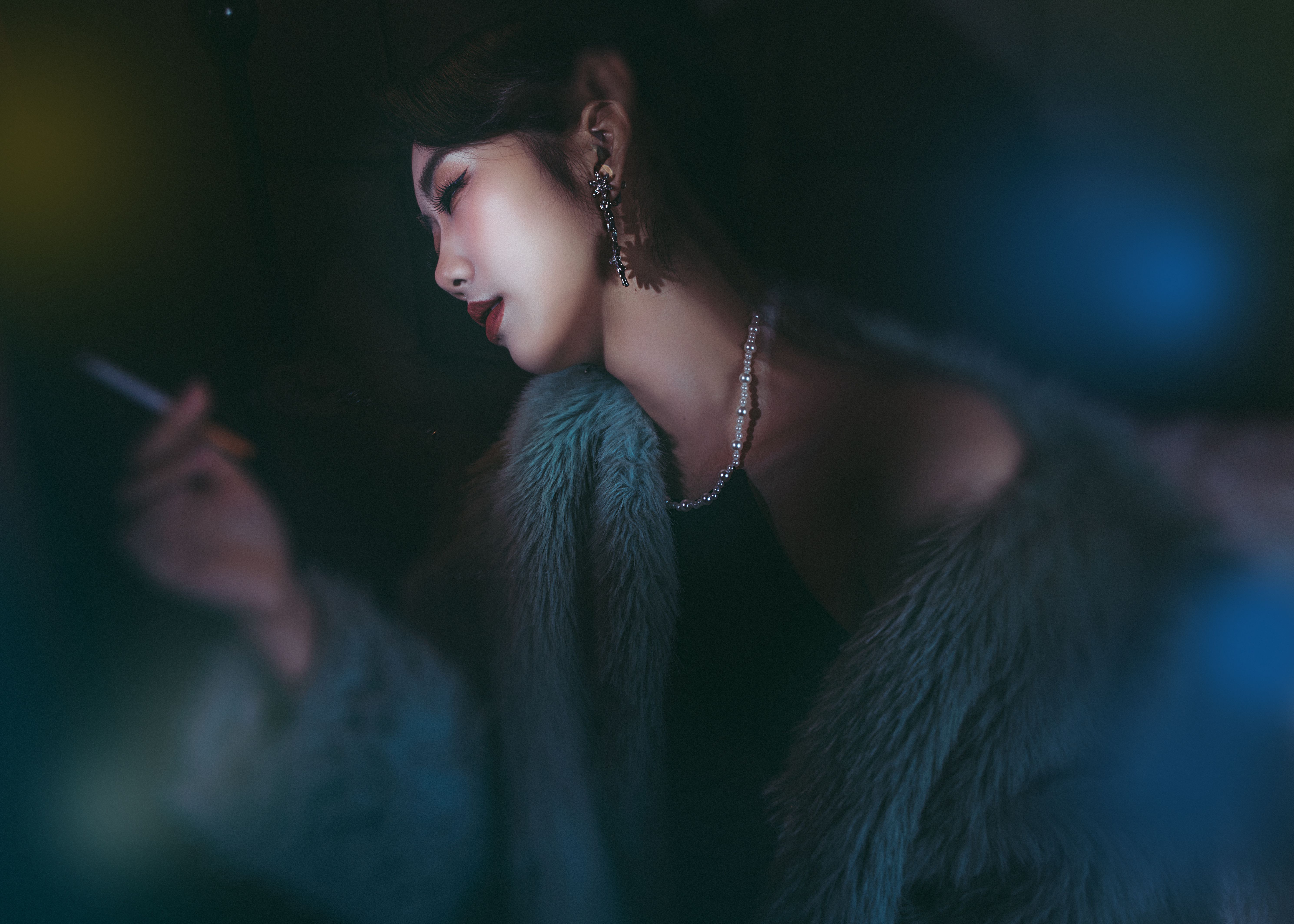 Glamorous Woman in Low Light Smoking · Free Stock Photo