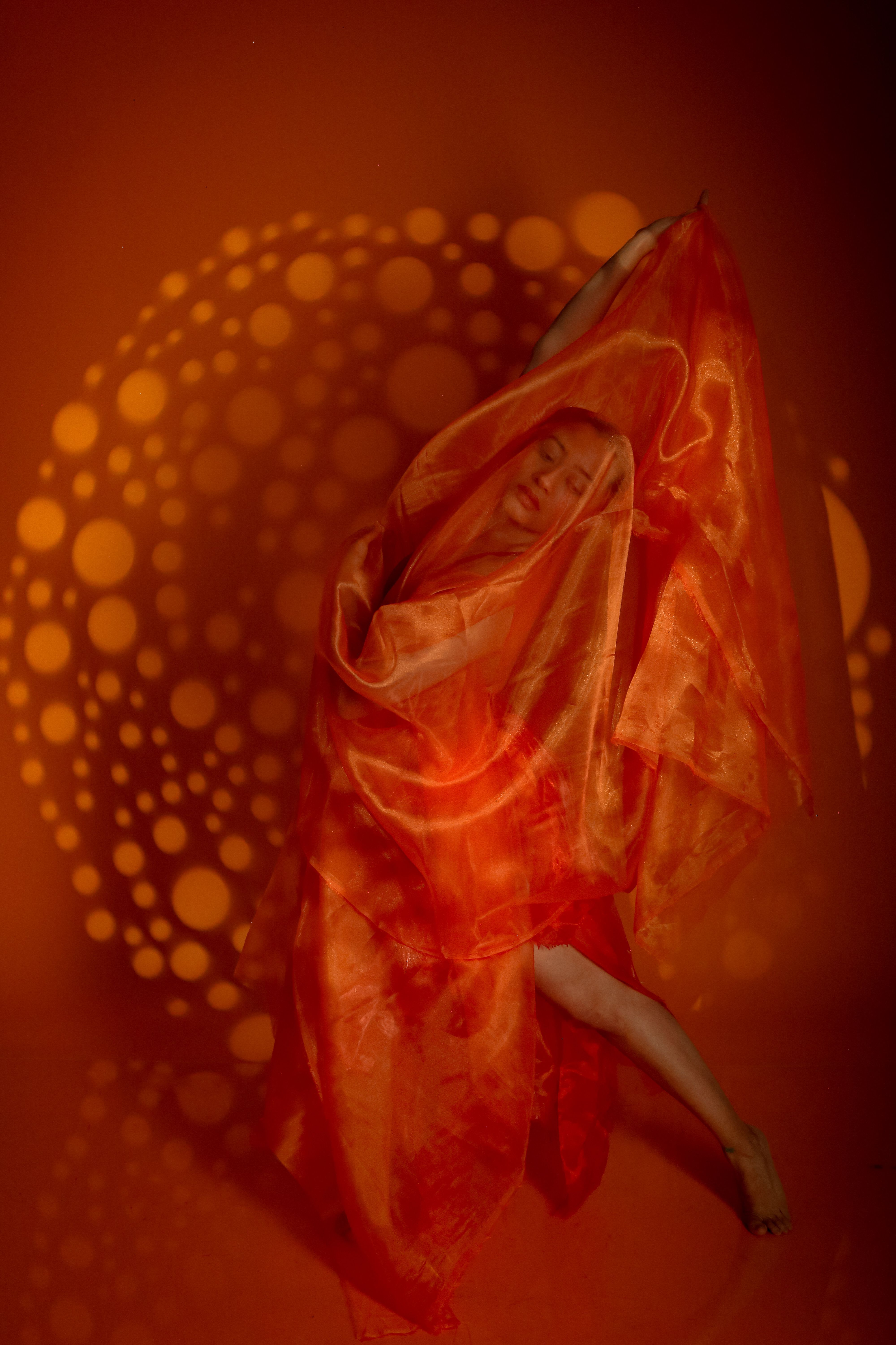 Artistic Expression with Draped Orange Fabric · Free Stock Photo