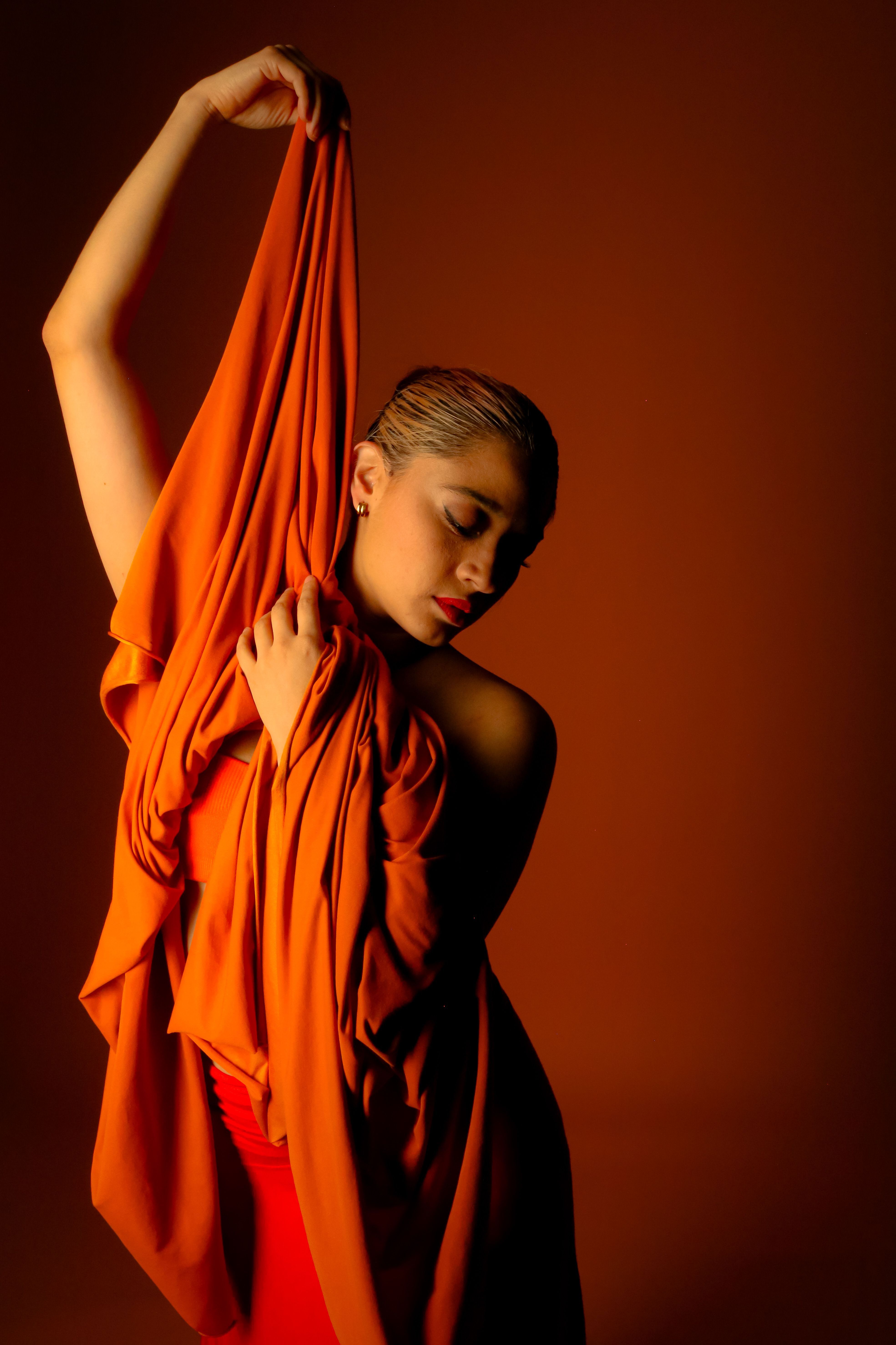 Graceful Woman Draped in Vibrant Fabric · Free Stock Photo