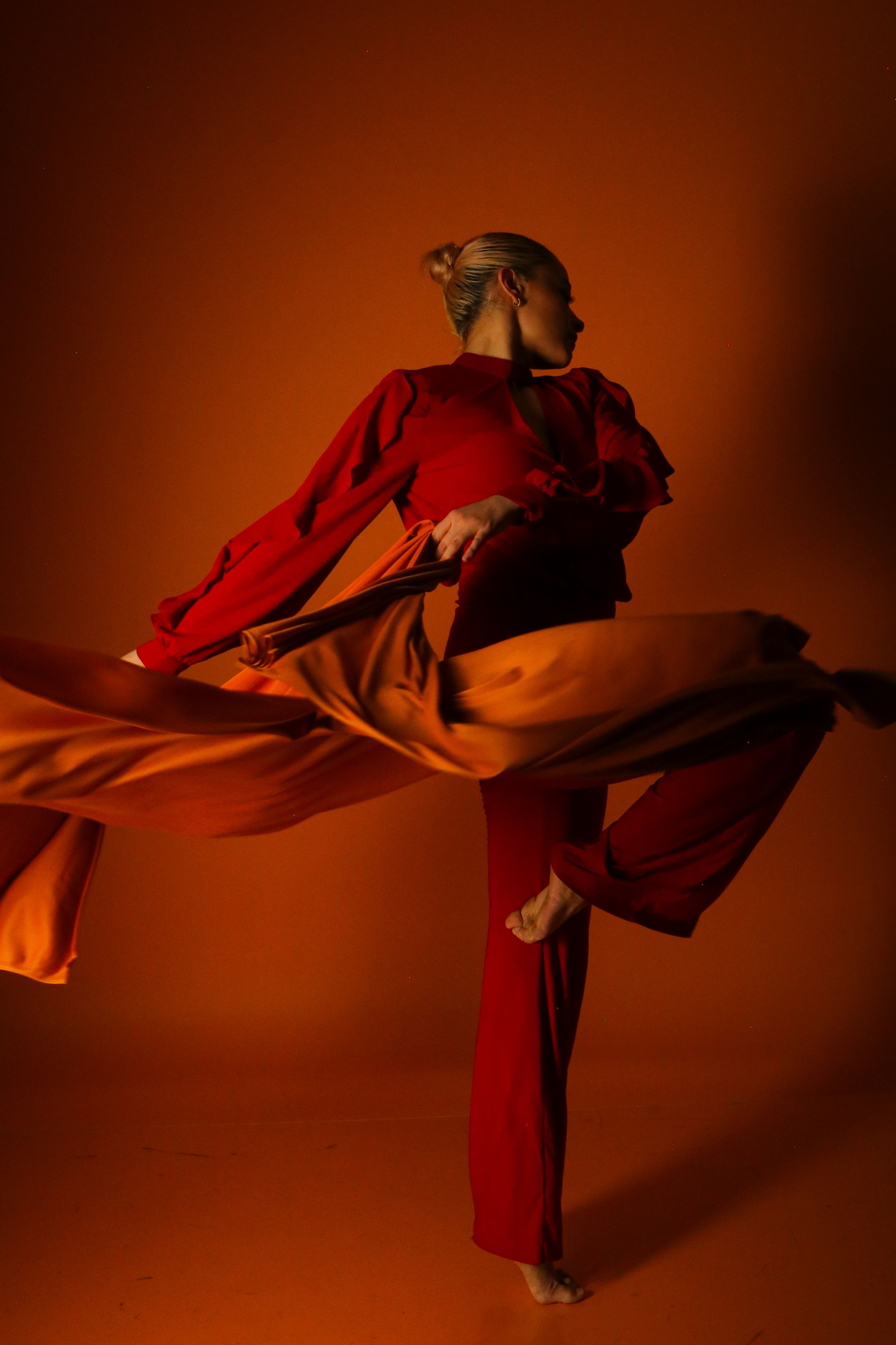 Elegant Dance Pose with Flowing Fabric · Free Stock Photo
