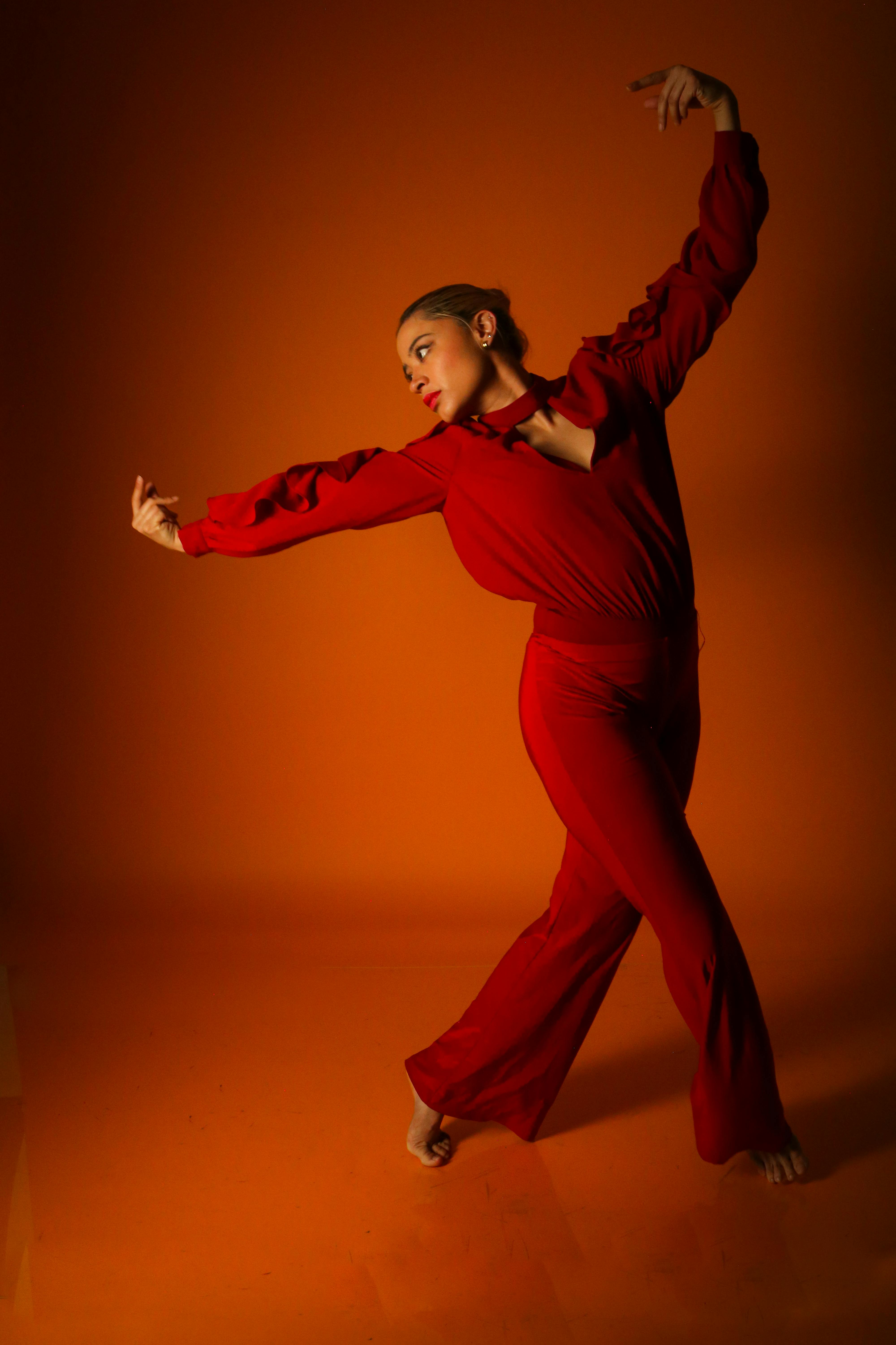 Expressive Dance in Vibrant Red Ensemble · Free Stock Photo