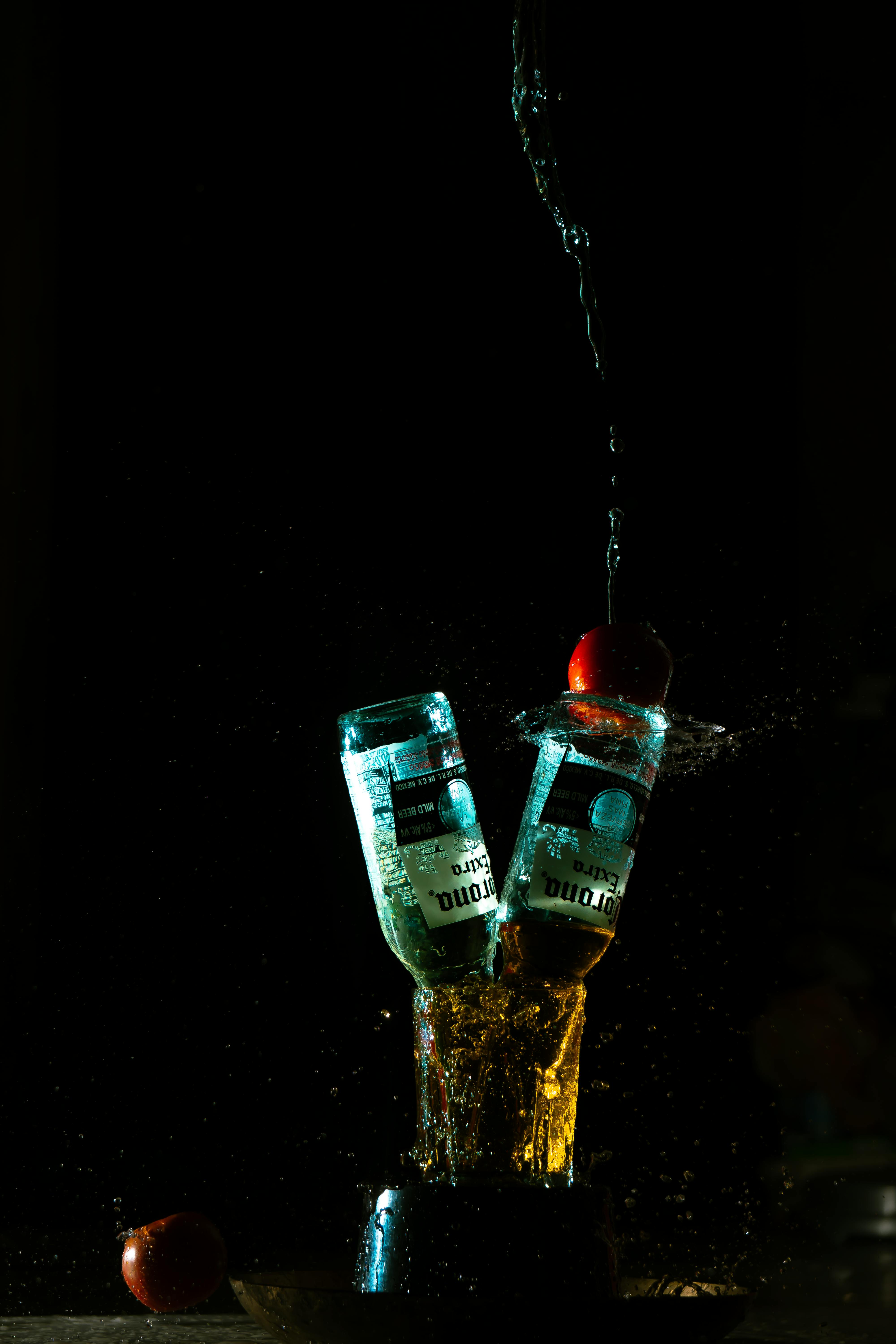 Dynamic Shot of Corona Beer Bottles with Splashes · Free Stock Photo